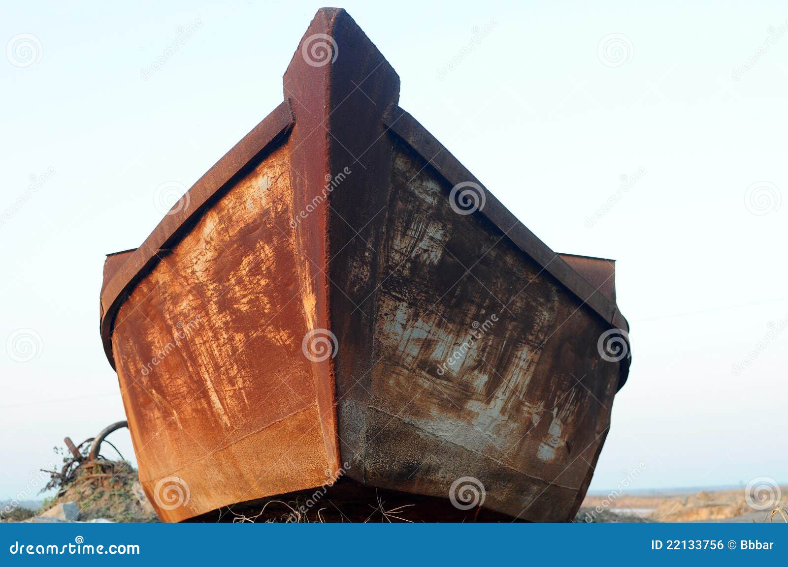 An Old Iron Boat Docked On The Shore Of A Canal Or Lake. Tied With A ...
