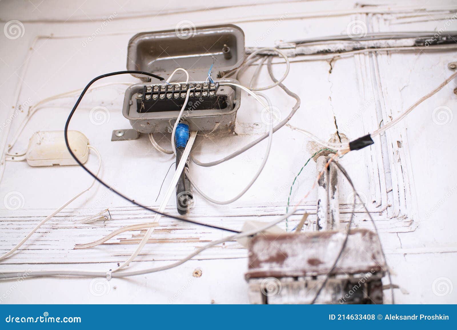 An Old Junction Box with Wires on a Light Wall Stock Photo - Image of ...