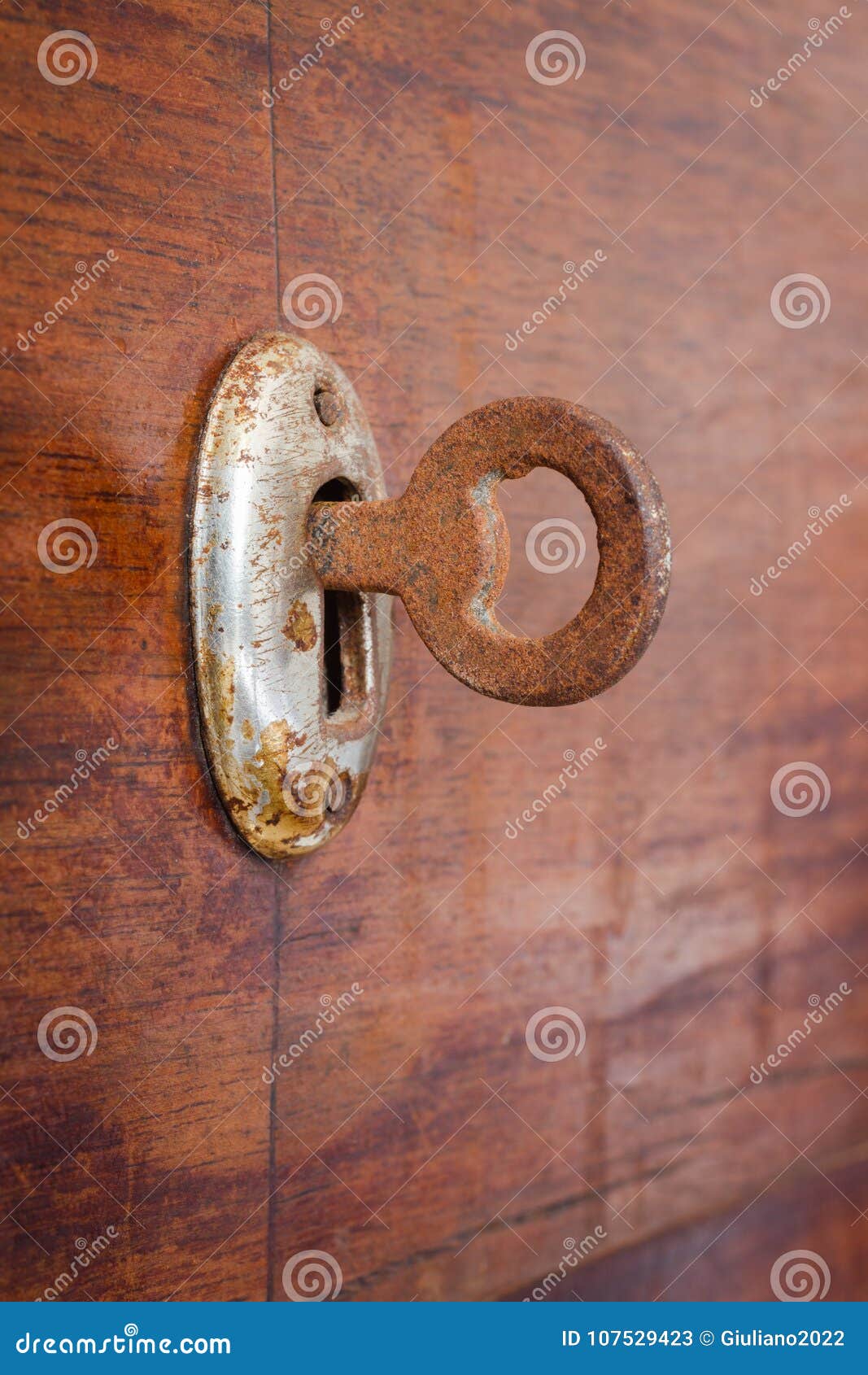 Old key in a keyhole stock image. Image of wooden, vintage - 107529423