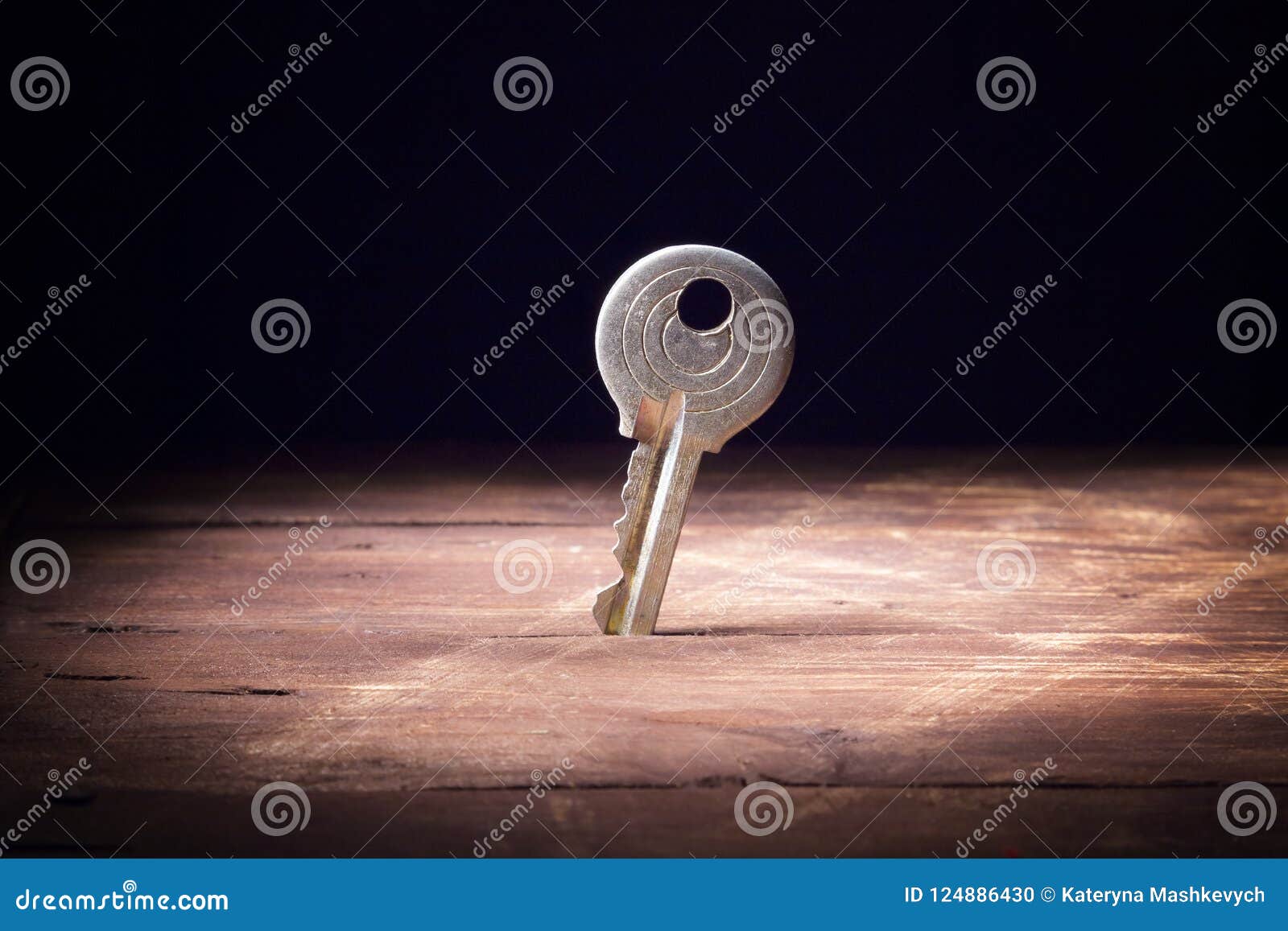 Old Key Standing Upright on a Wooden Table Surface Stock Photo - Image ...