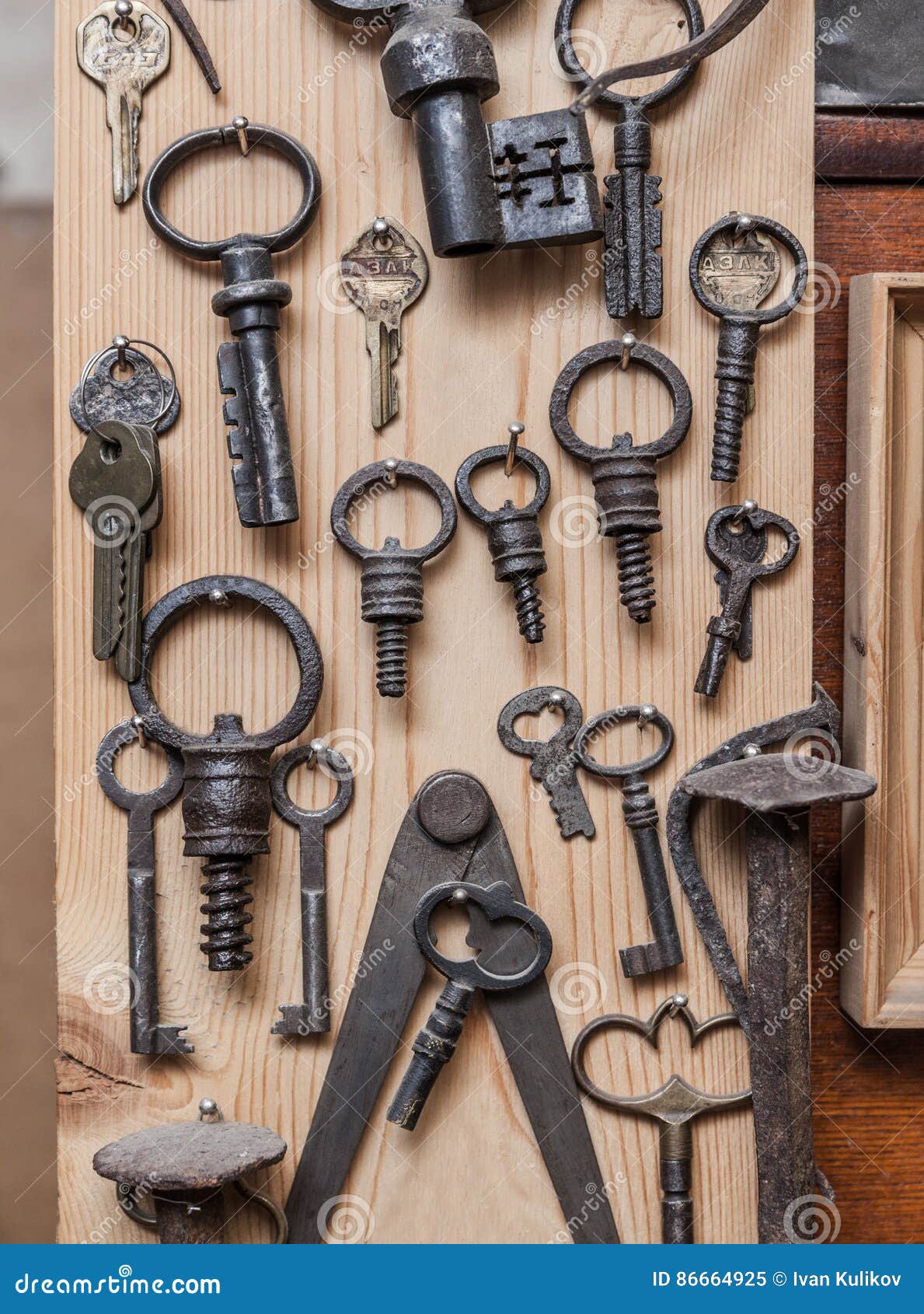 Old keys on wood wall stock image. Image of collection - 86664925