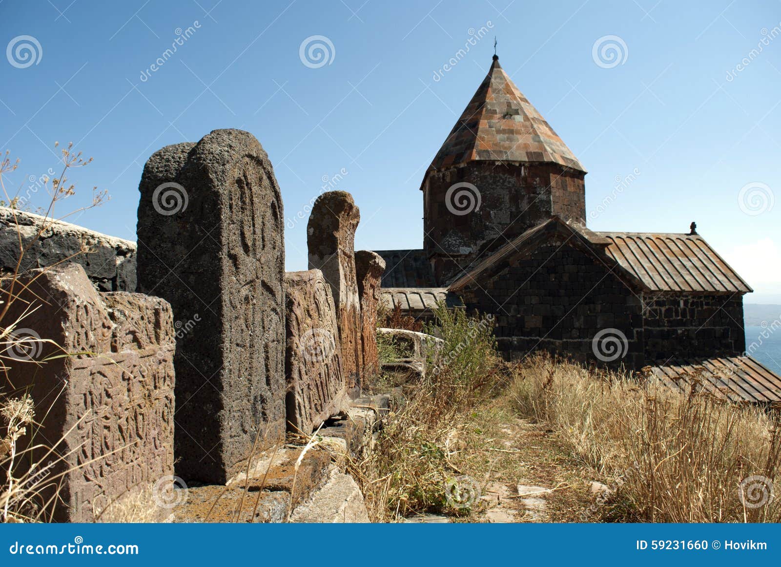 Old Khachkar (cross) in the Island Monastery or Sevanavank (church) in ...