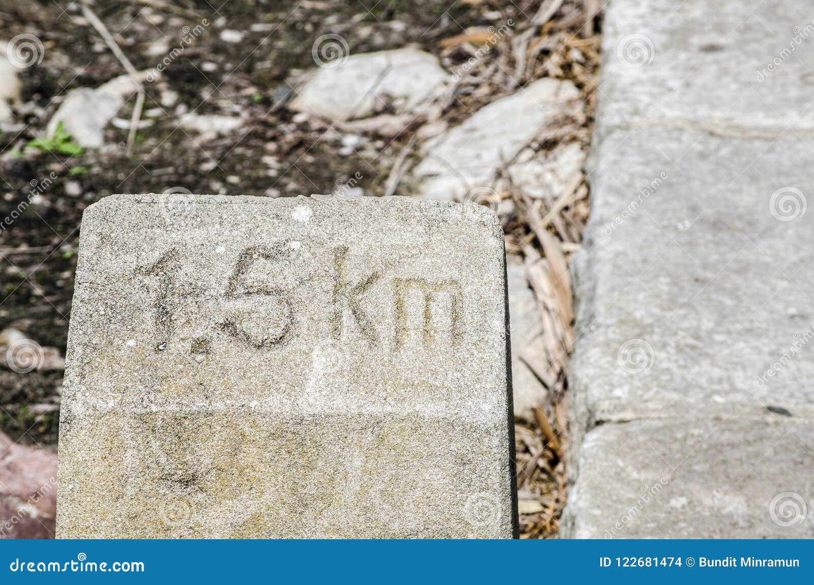 Old Kilometer Stone Says ` 1.5 KM.` To Get into the Destination Stock ...
