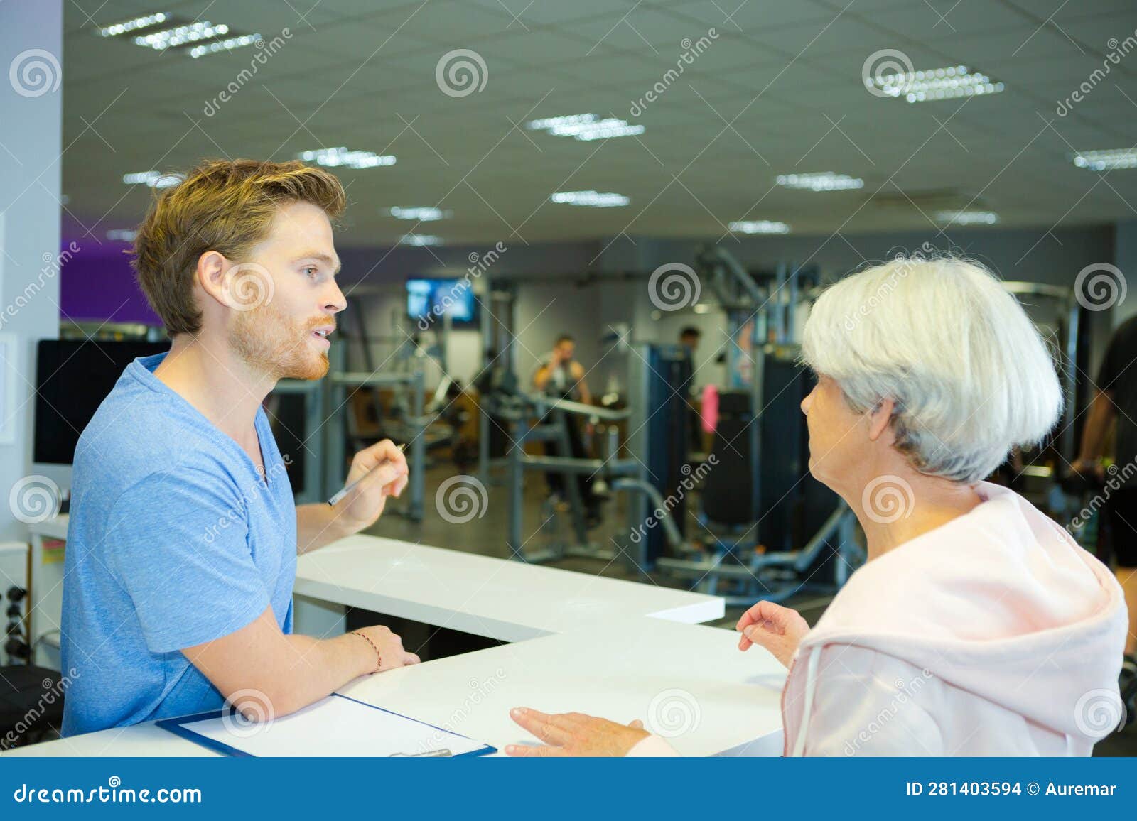 Old Lady Asking for Advice To Young Trainer Stock Photo - Image of ...