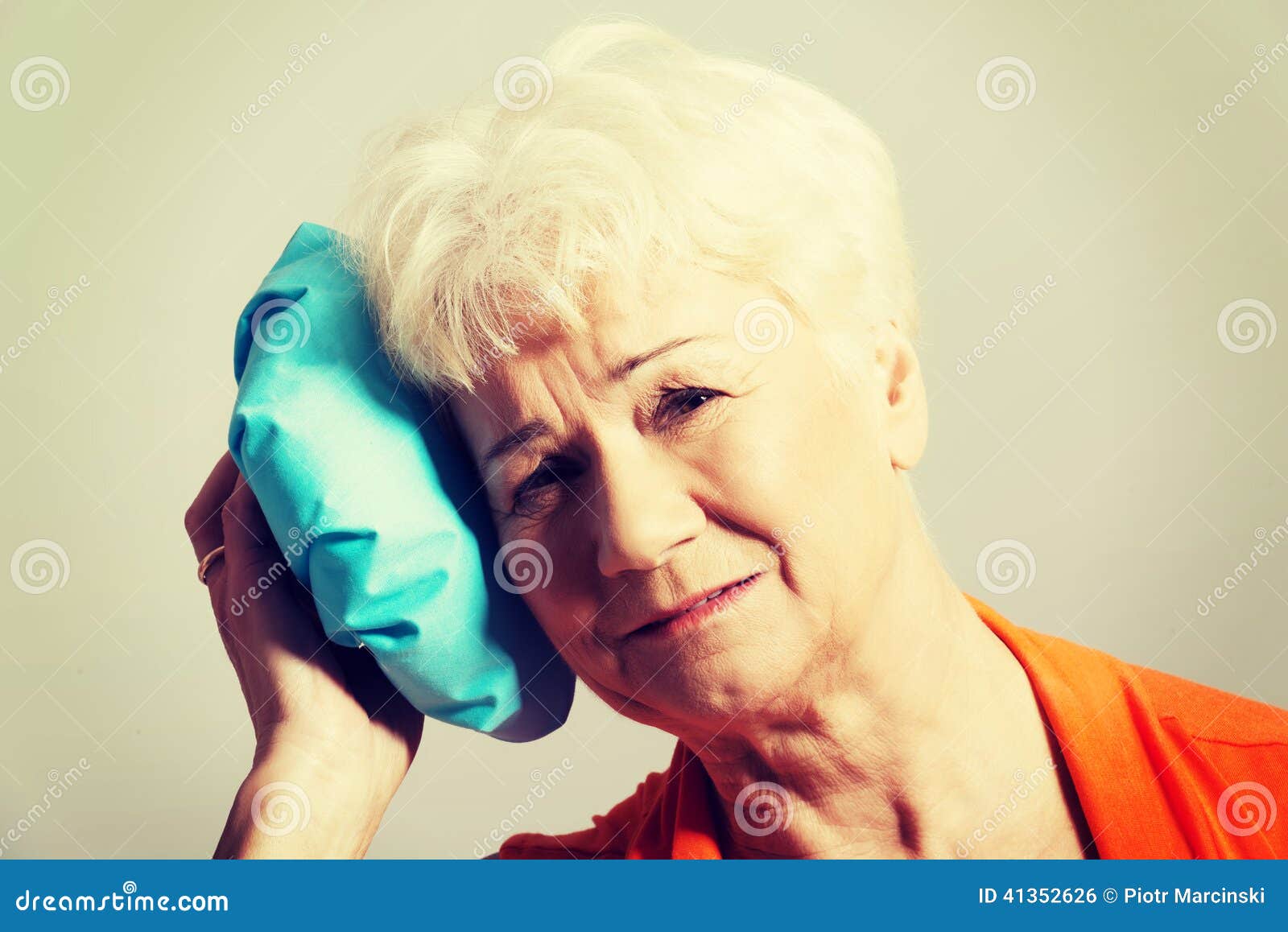 An Old Lady with Ice Bag by Her Head Stock Photo - Image of older, ache ...