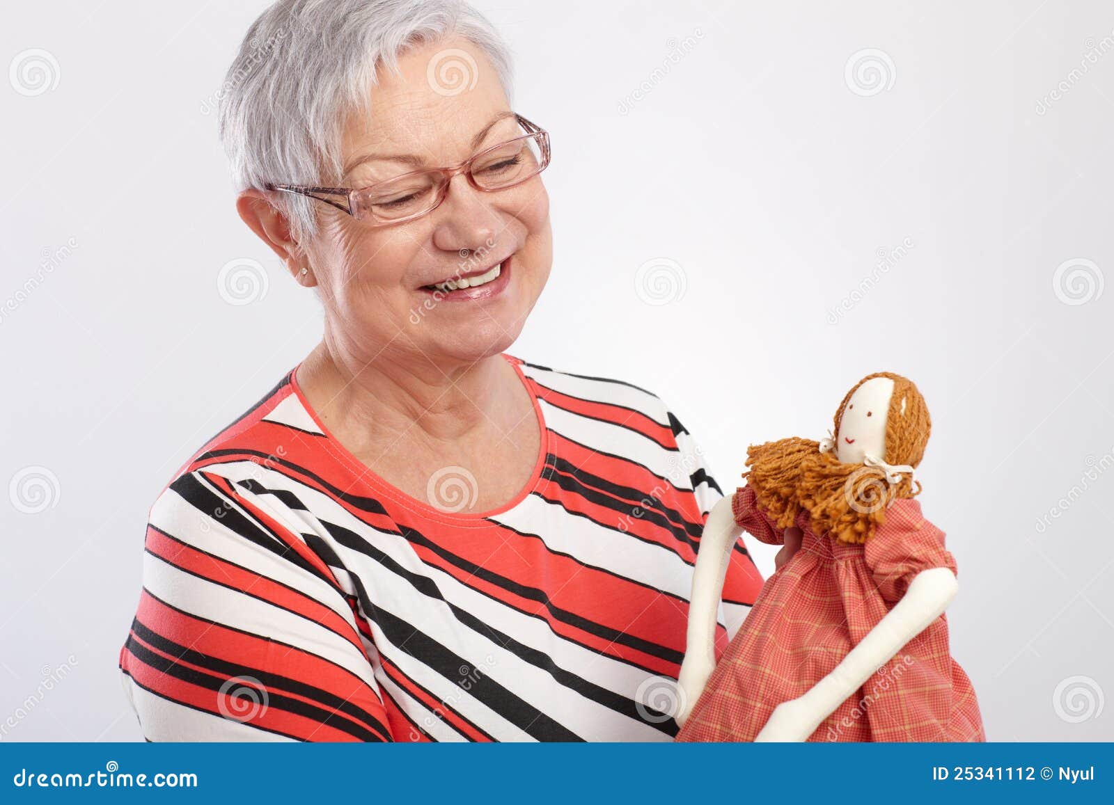 Old Lady Playing with Rag Doll Smiling Stock Photo - Image of ...