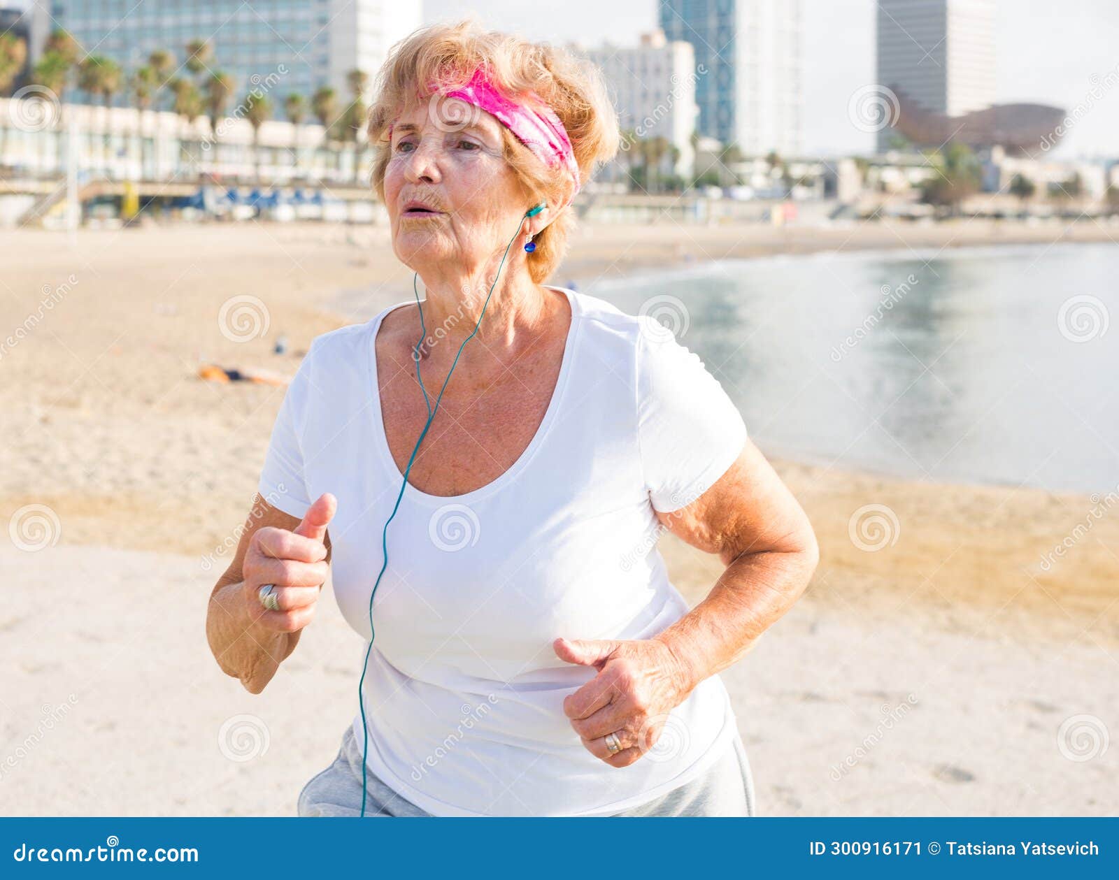 Old Lady Running beside Beach Stock Image - Image of caucasian, german ...