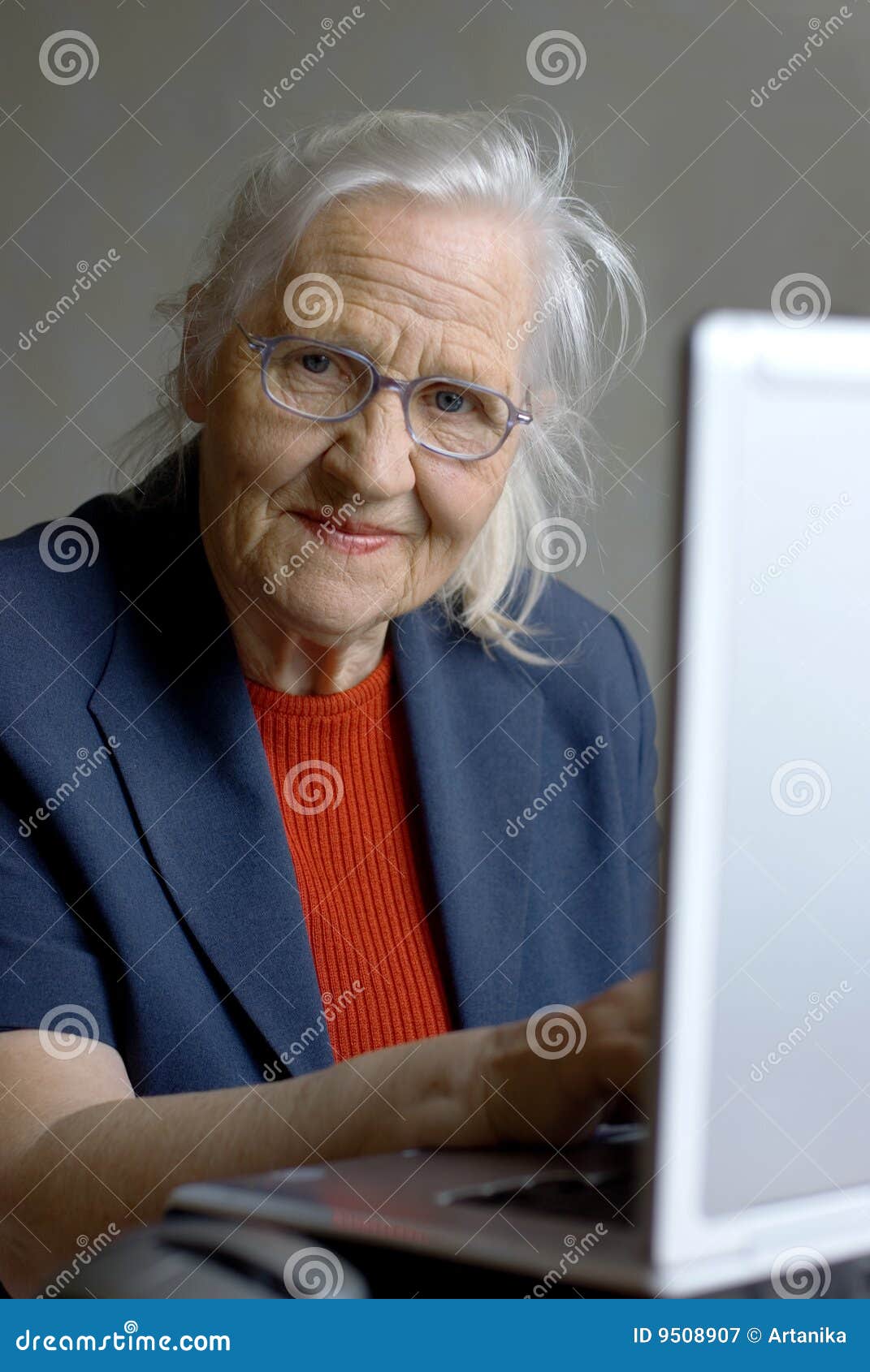 Old lady typing on laptop stock image. Image of white - 9508907