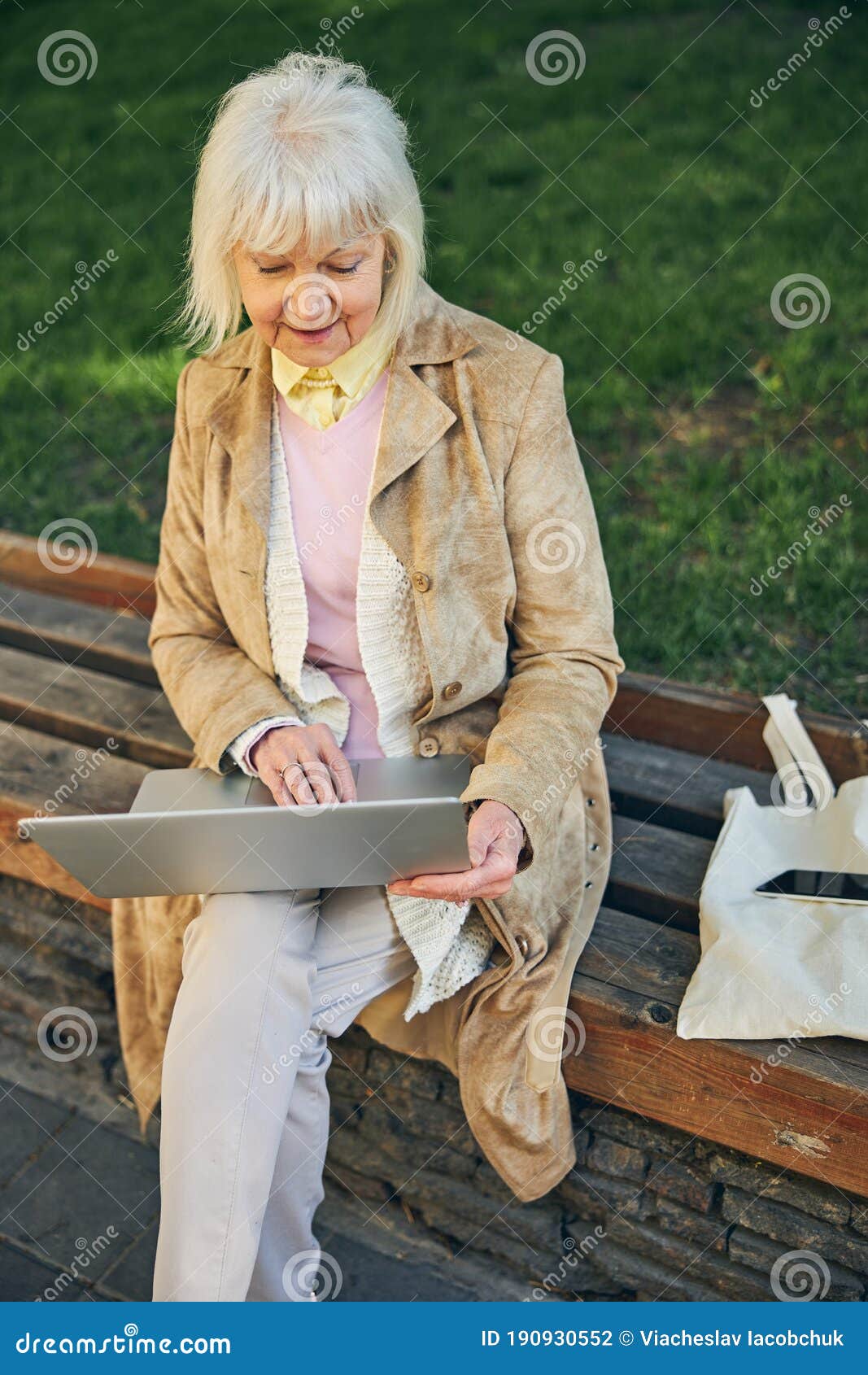 Old Lady Using Computer and Resting in Park Stock Photo - Image of ...