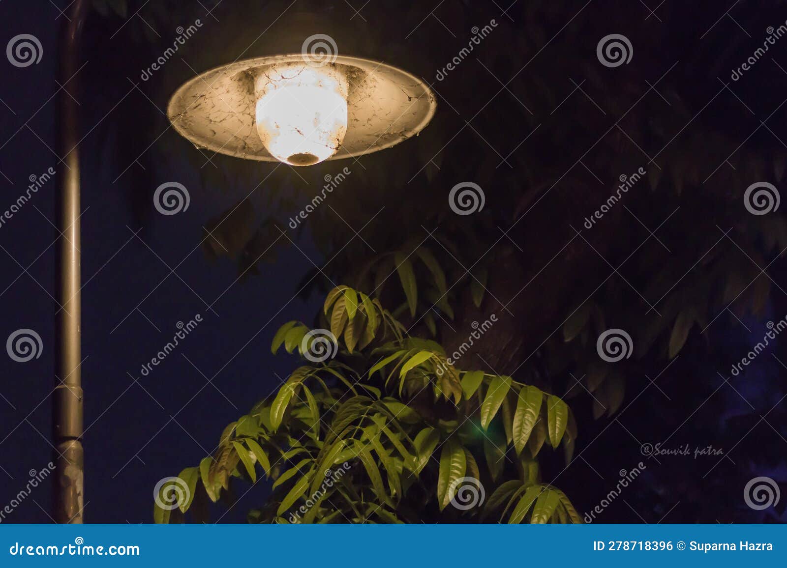 Old Lamp Post with White Yellow Light Illuminated at the Street Side ...