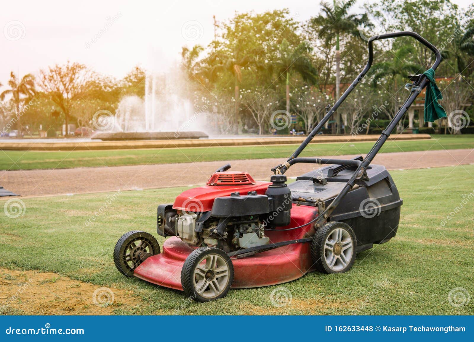 A Old Lawn Mower Machine on Grass Field Stock Photo - Image of engine ...