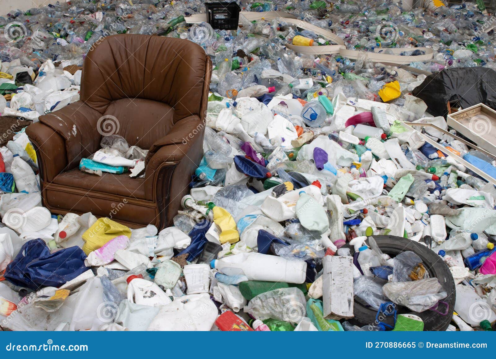 Old Leather Chair and Plastic Garbage in a Landfill - a Problem of ...