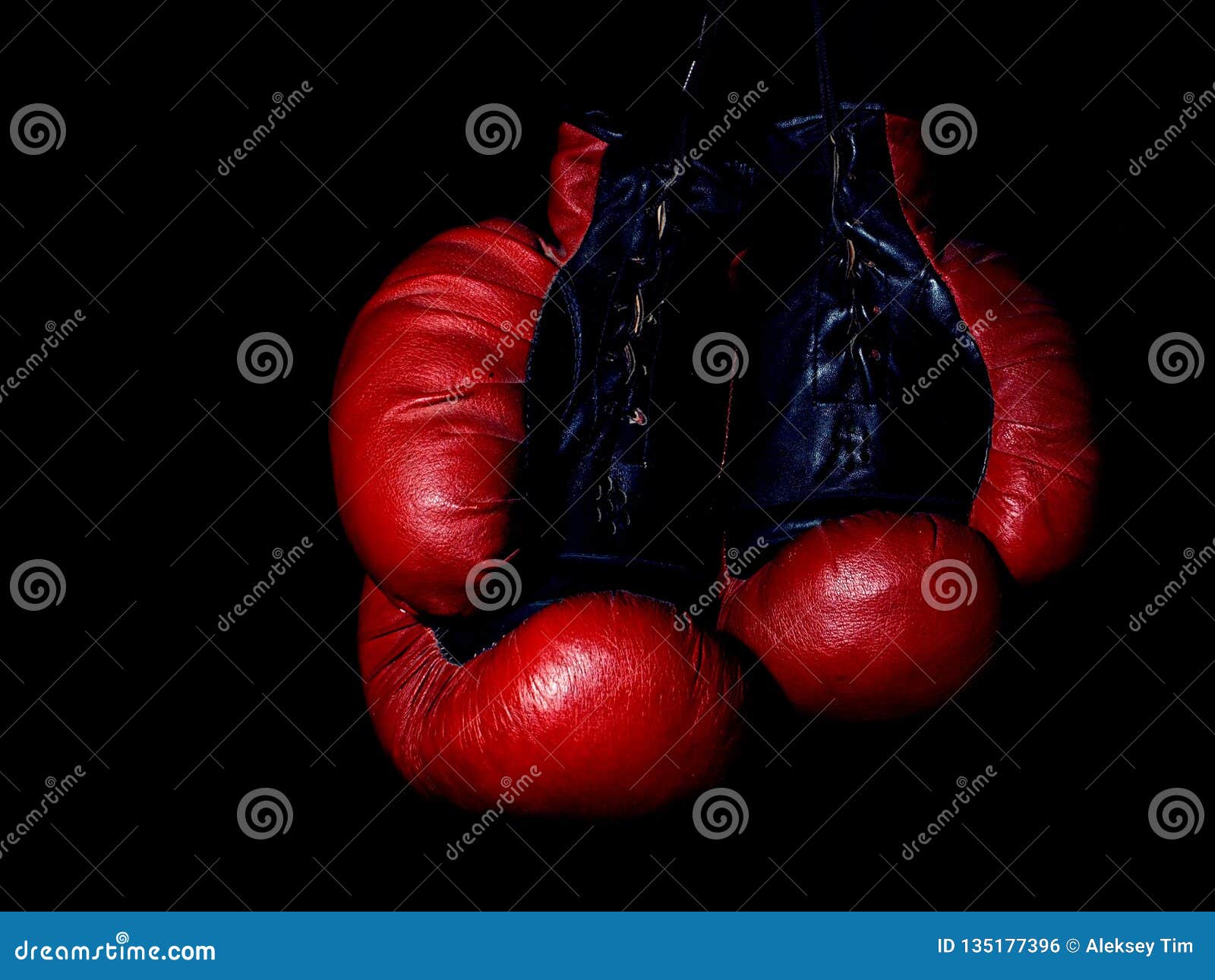 Old Leather Red Boxing Gloves Hanging in the Dark Stock Photo - Image ...