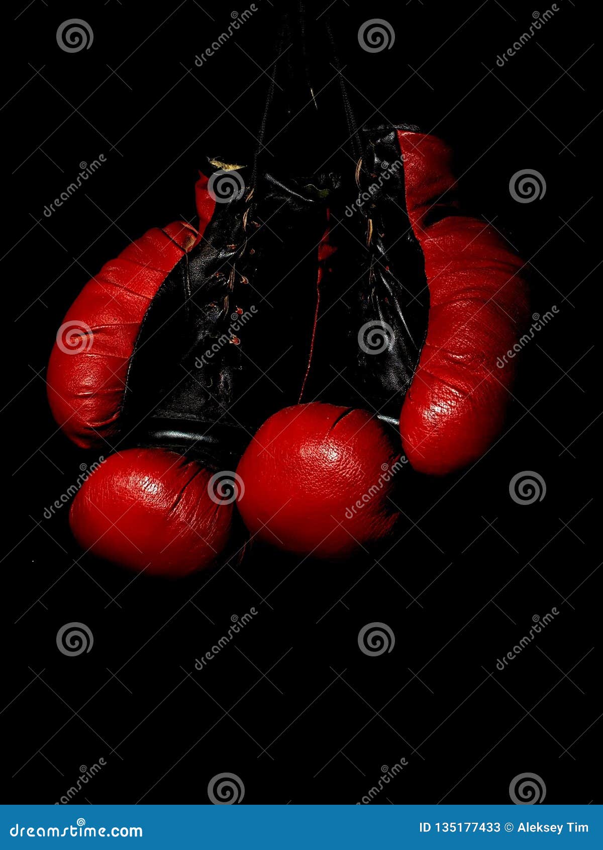 Old Leather Red Boxing Gloves Hanging in the Dark Stock Image - Image ...