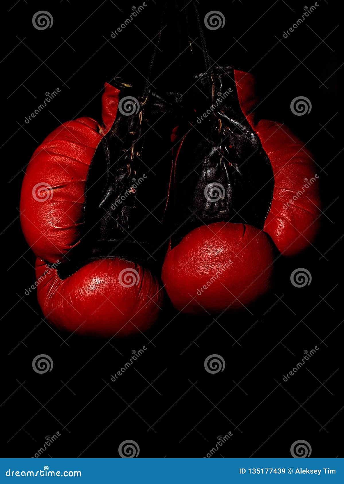 Old Leather Red Boxing Gloves Hanging in the Dark Stock Image - Image ...