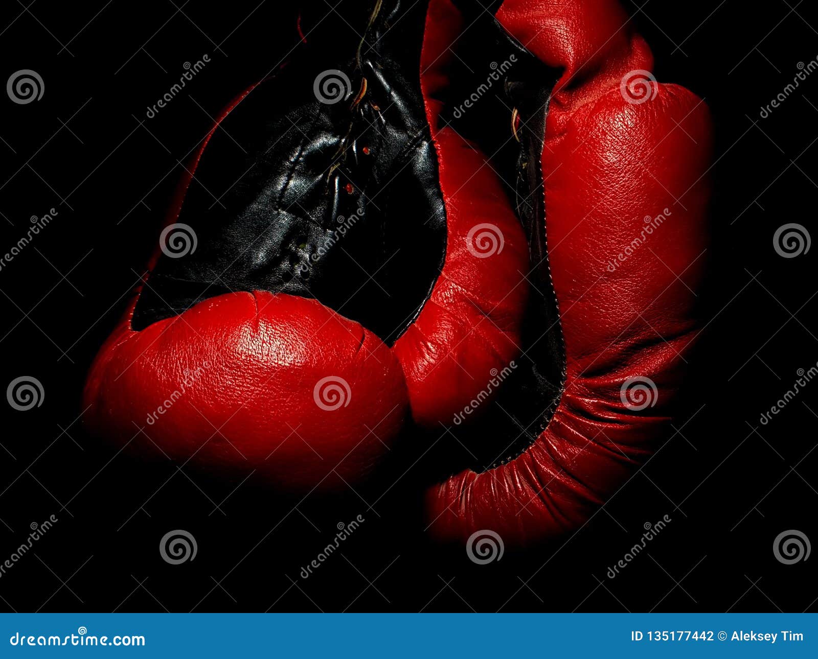 Old Leather Red Boxing Gloves Hanging in the Dark Stock Photo - Image ...