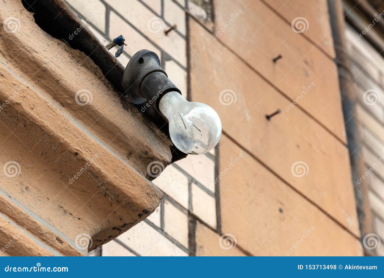 Old Light Bulb on the Facade of an Abandoned Building. Stock Photo ...