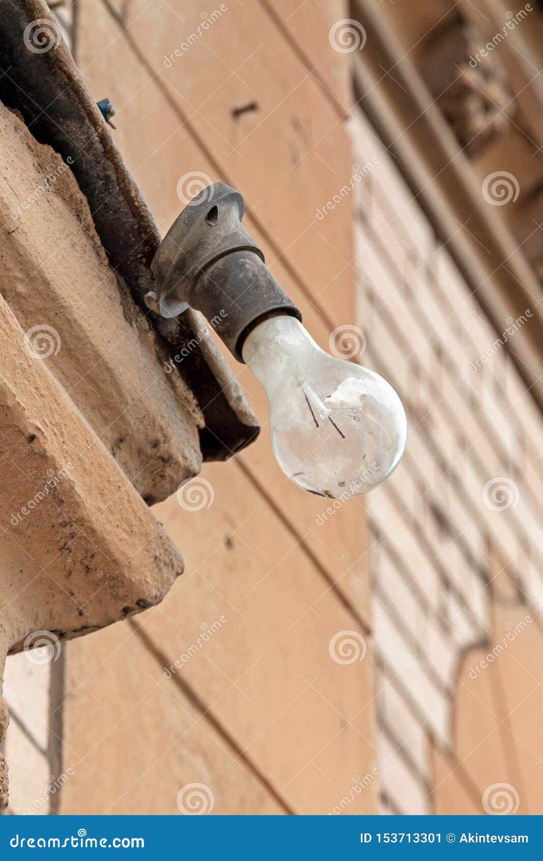 Old Light Bulb on the Facade of an Abandoned Building. Stock Image ...