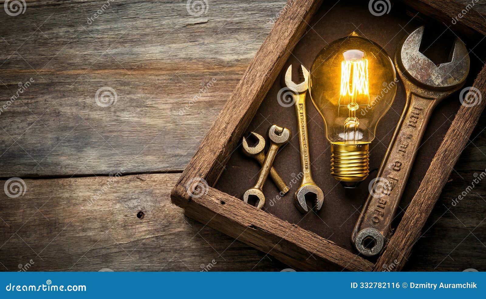 An Old Light Bulb and Worn and Rusted Wrenches are Found in a Wooden ...