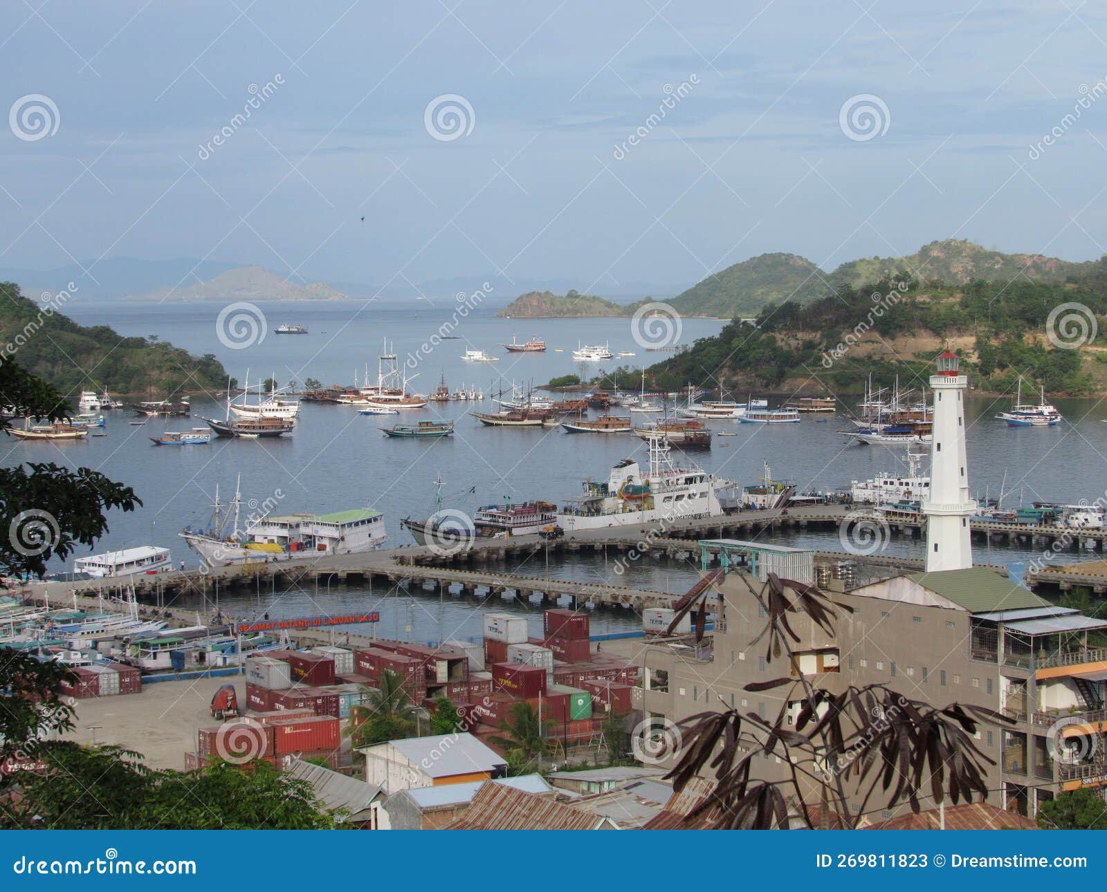 Old Lighthouse at harbor editorial stock photo. Image of ships - 269811823