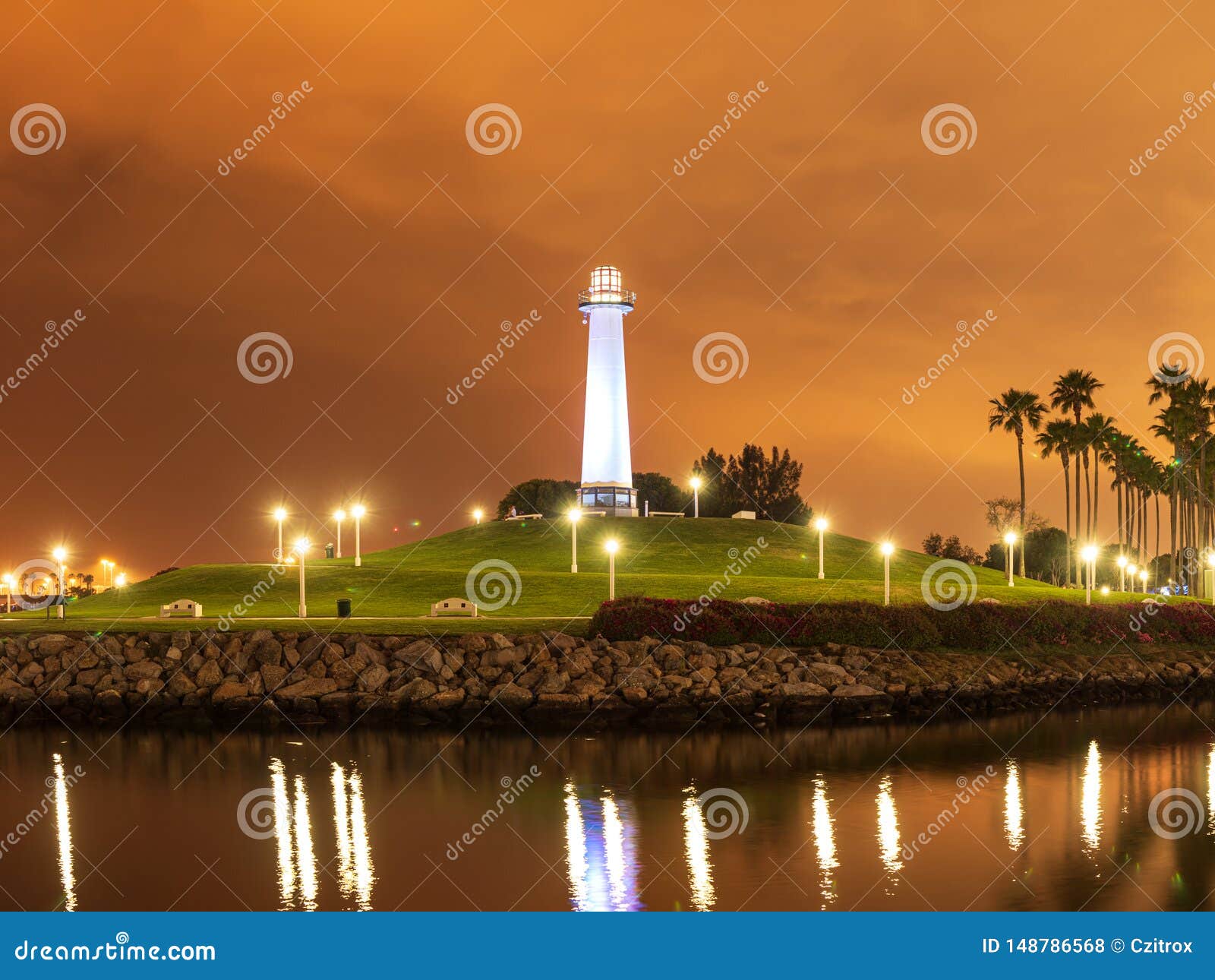 Old Lit Lighthouse on Island at Night Stock Photo - Image of marine ...