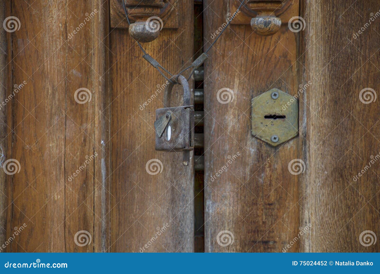 Old lock on a wooden door stock photo. Image of construction - 75024452