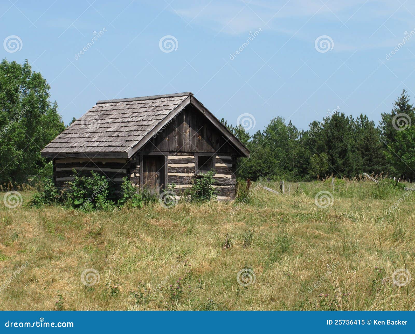 Old log shack in a field. stock image. Image of wood - 25756415