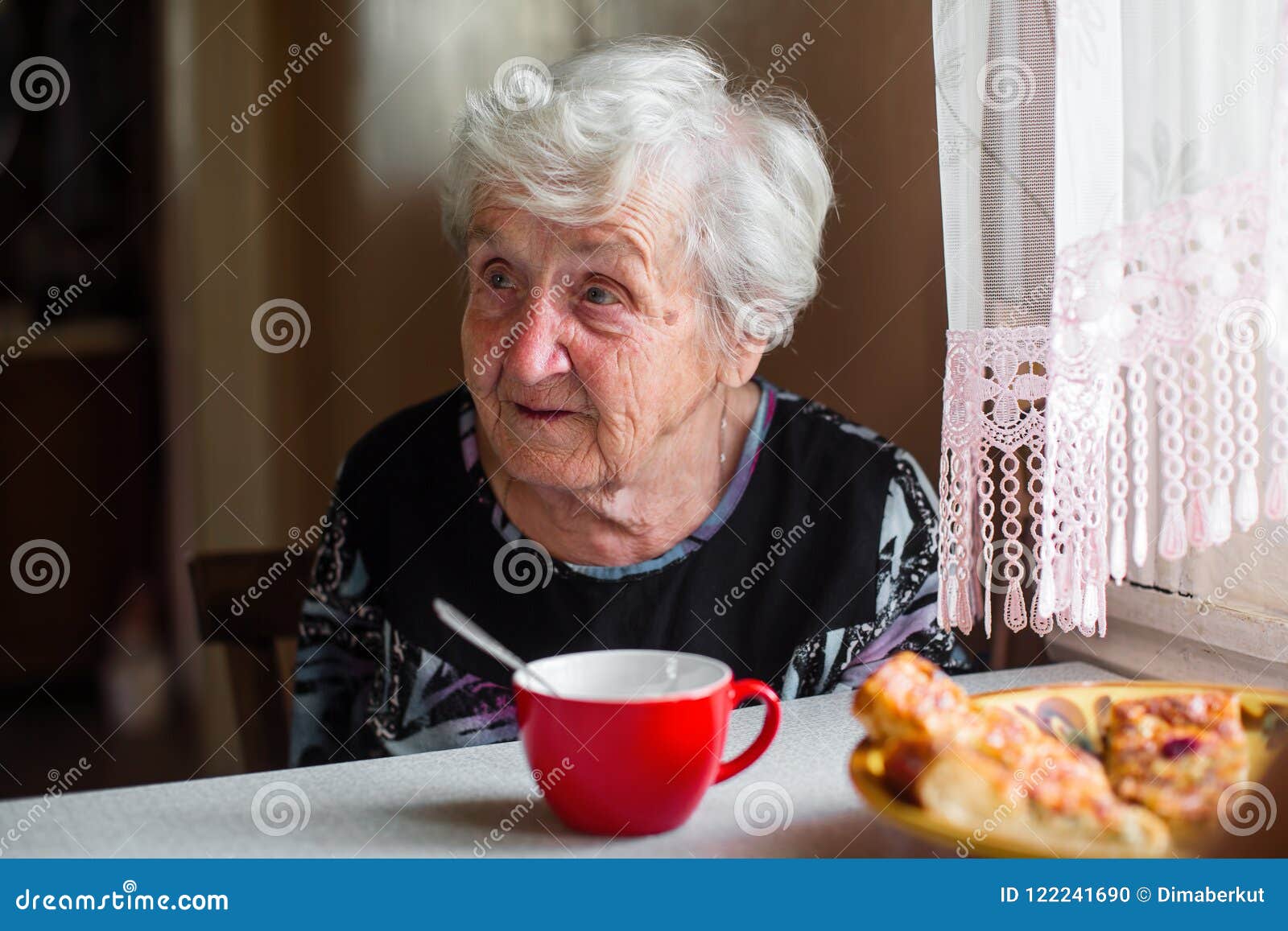 Old Lady is Sitting at the Kitchen Table. Stock Photo - Image of ...