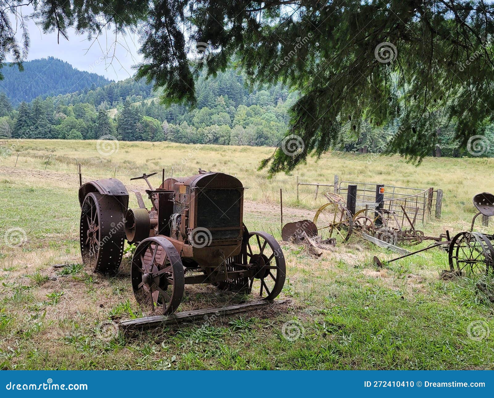 Old machines on a farm stock photo. Image of tractor - 272410410