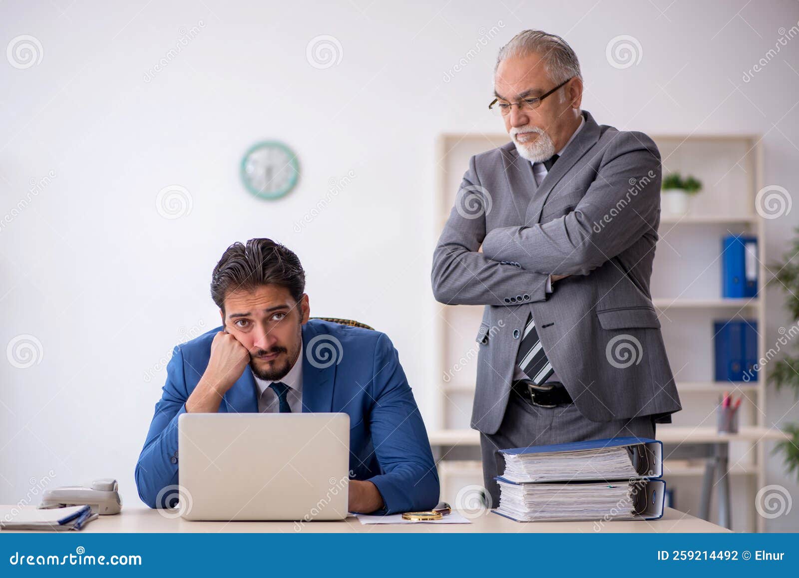 Old Male Boss and Young Male Employee Working in the Office Stock Photo ...
