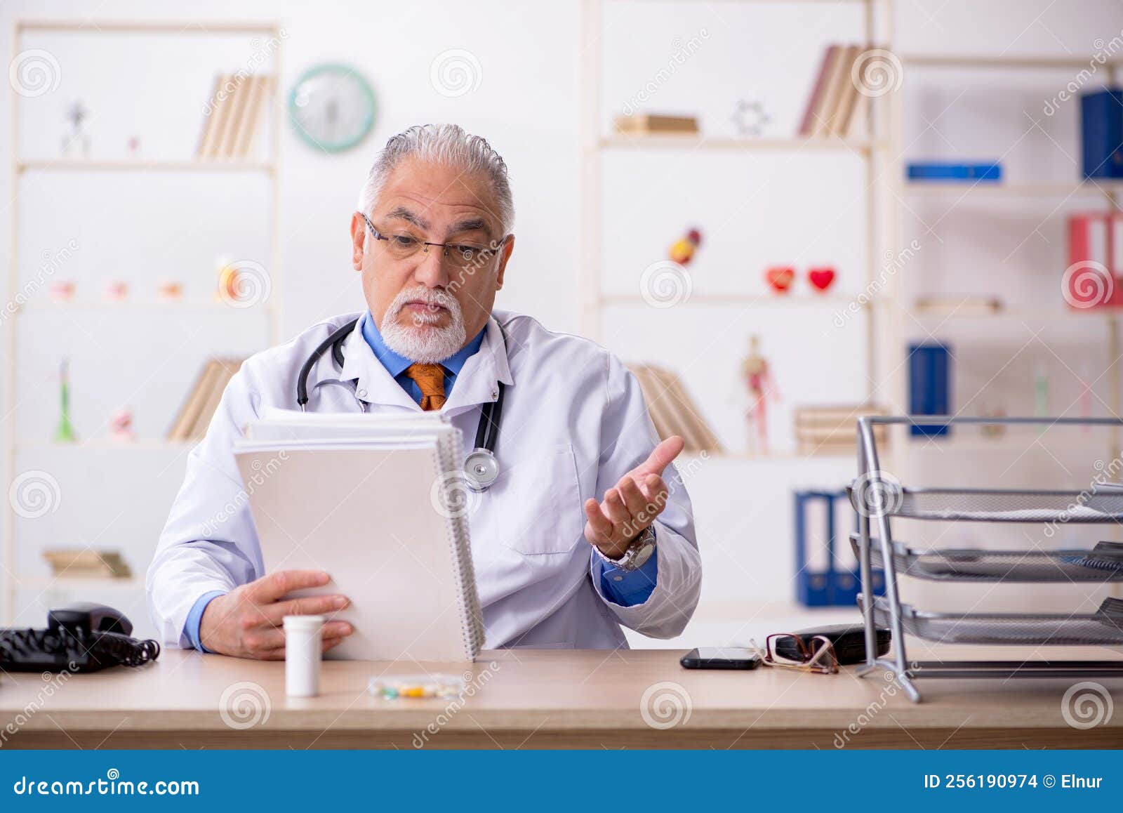 Old Male Doctor Working in the Clinic Stock Photo - Image of ...