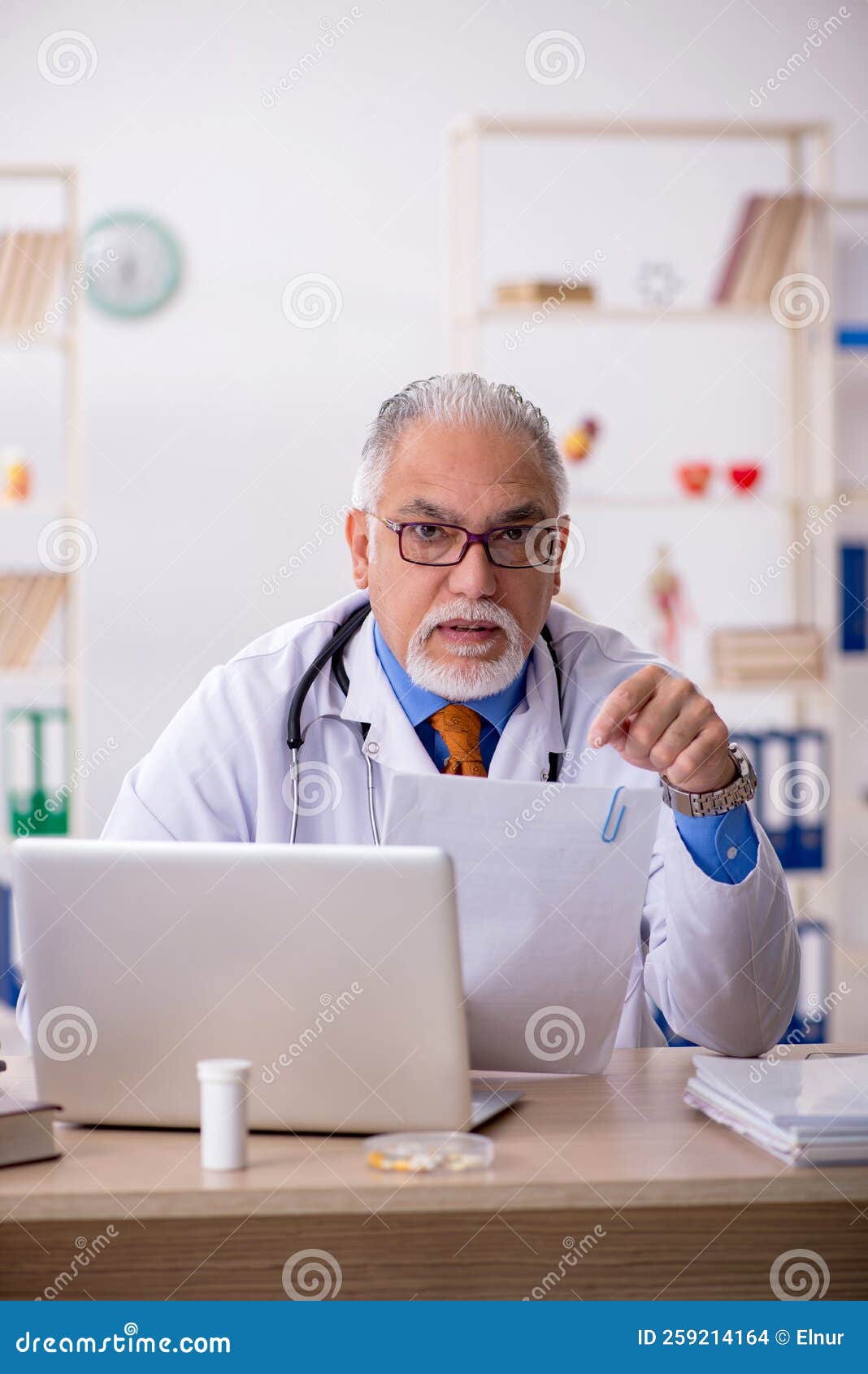 Old Male Doctor Working in the Clinic Stock Photo - Image of doctor ...