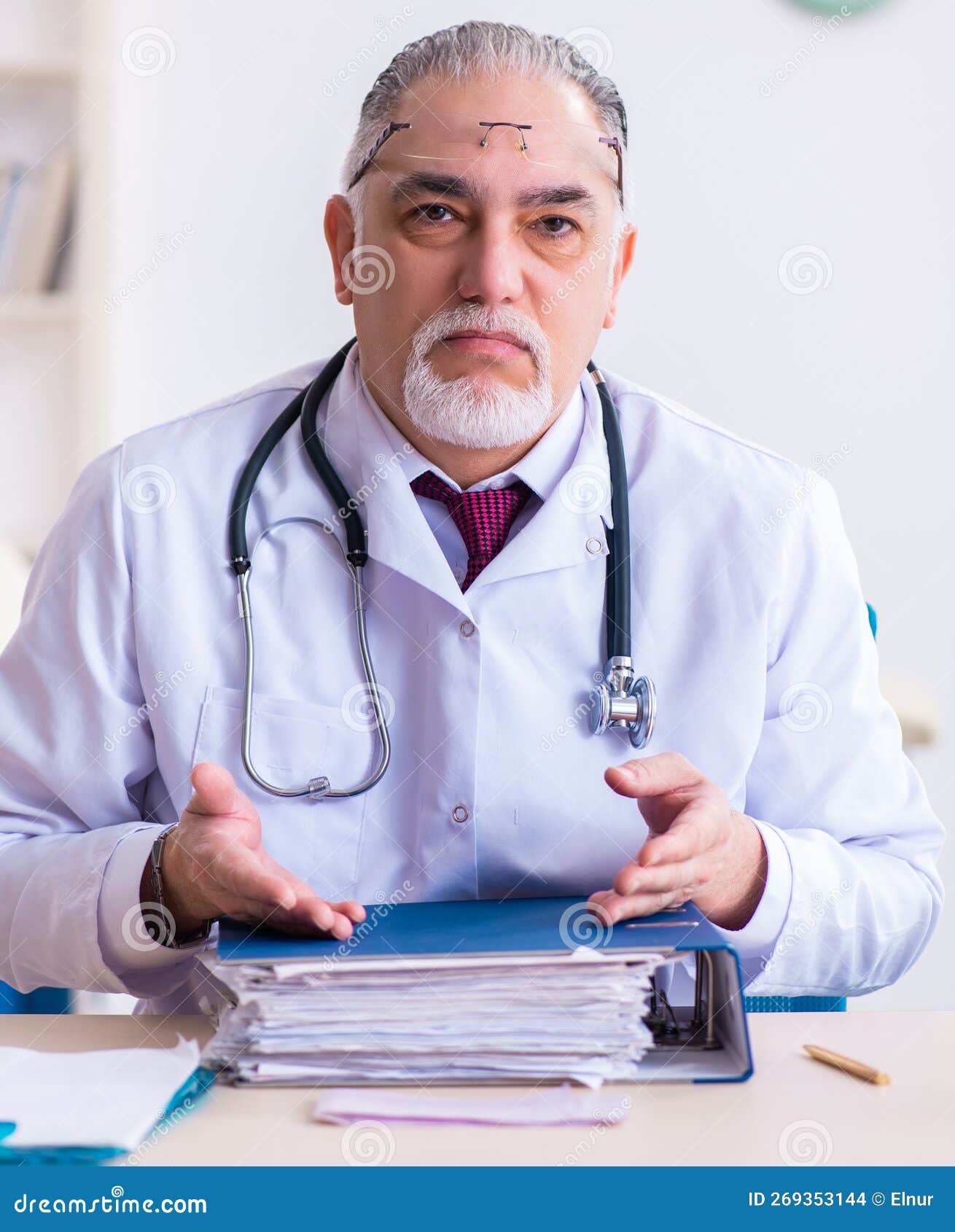 Old Male Doctor Working in the Clinic Stock Photo - Image of physician ...