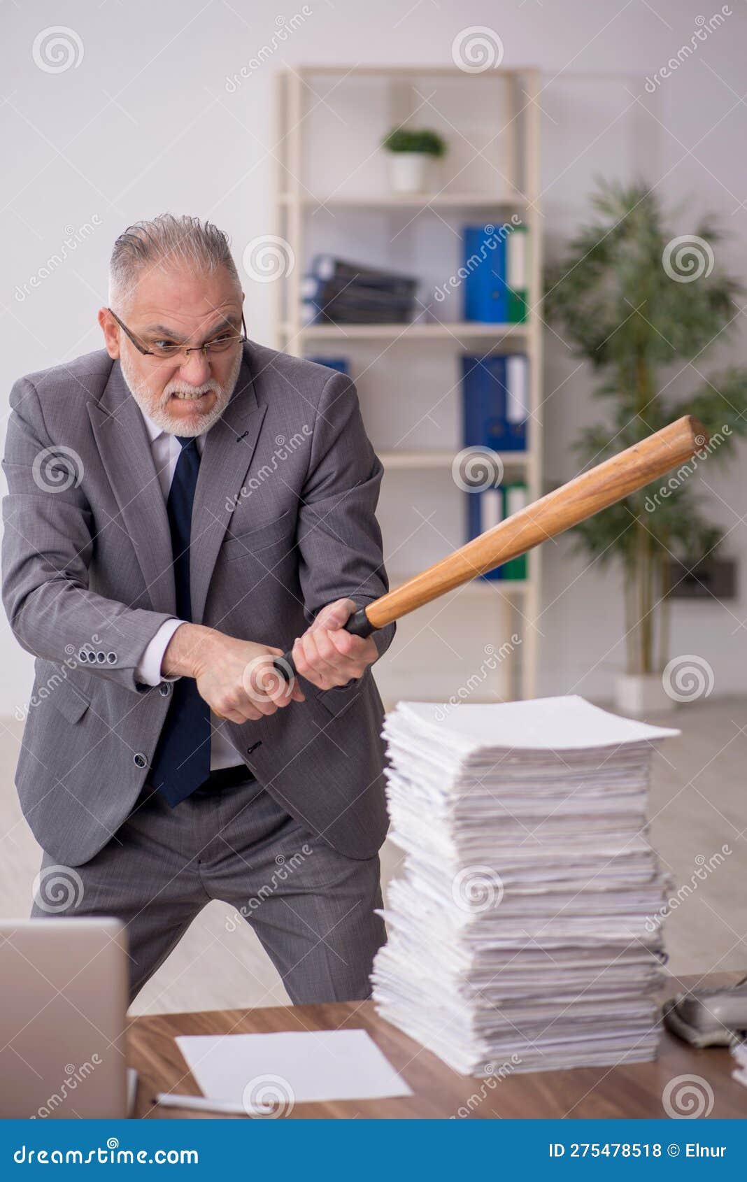 Old Male Employee Holding Baseball Bat at Workplace Stock Photo - Image ...