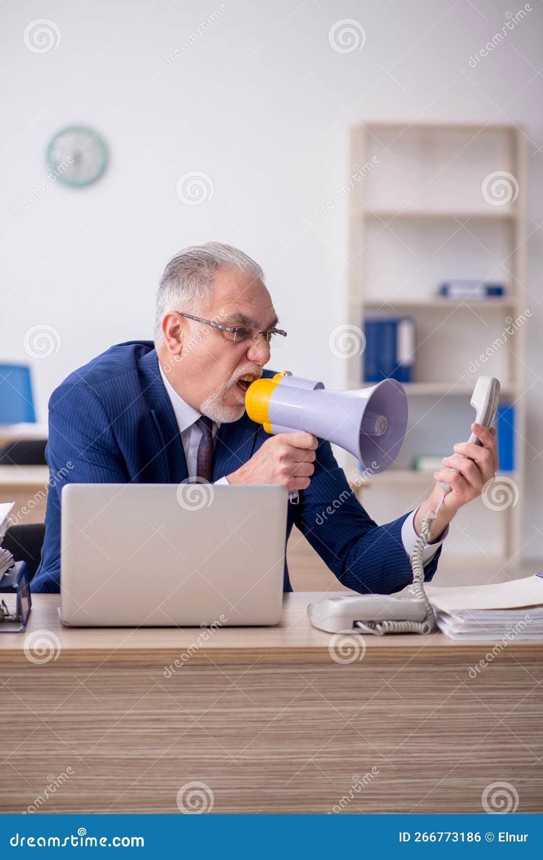 Old Male Employee Holding Megaphone at Workplace Stock Photo - Image of ...