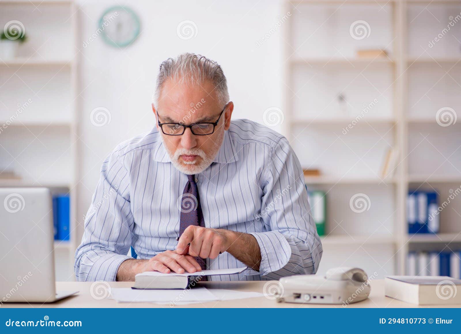 Old Male Employee Reading Book in the Office Stock Image - Image of ...