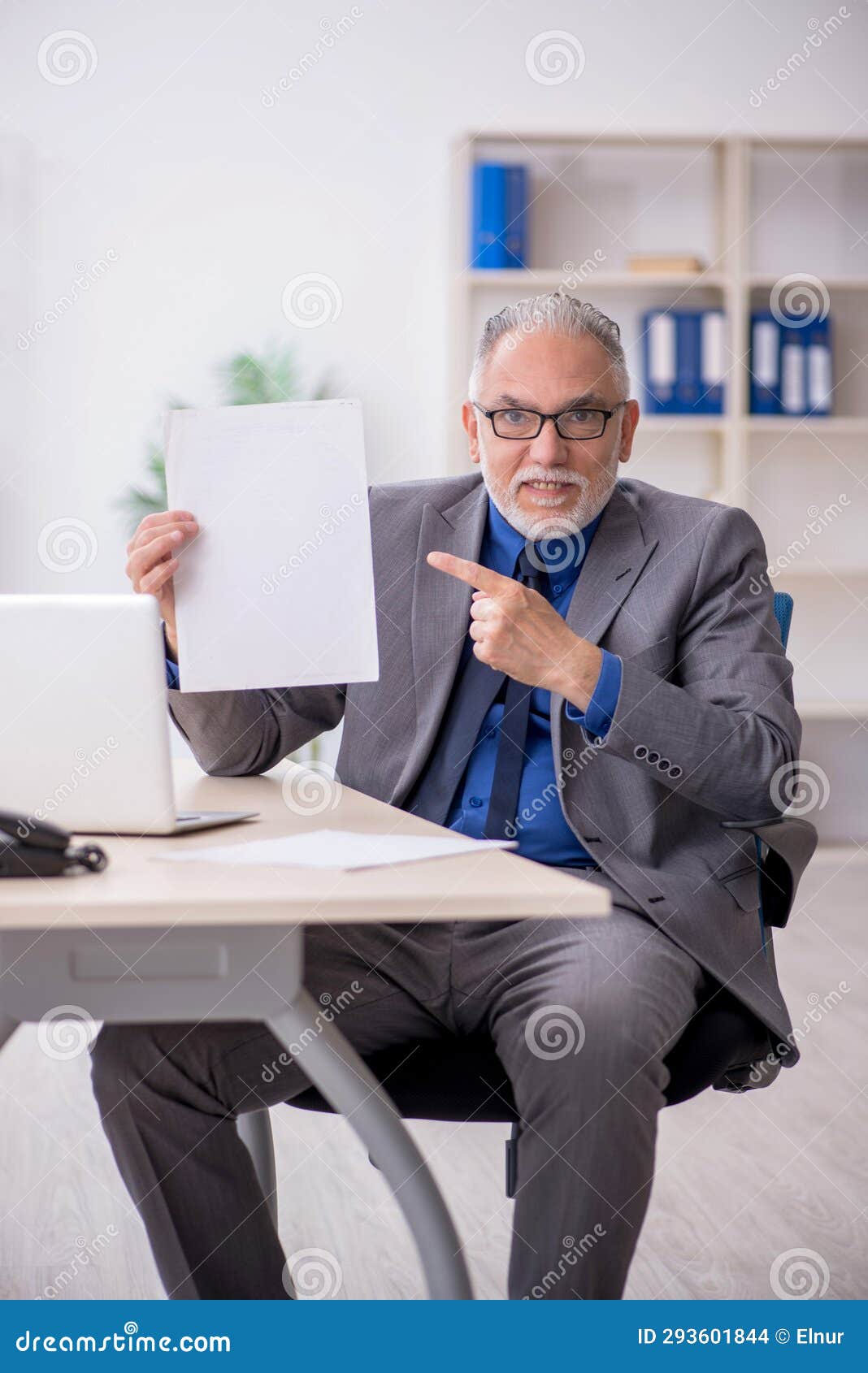 Old Male Employee Reading Paper at Workplace Stock Photo - Image of ...