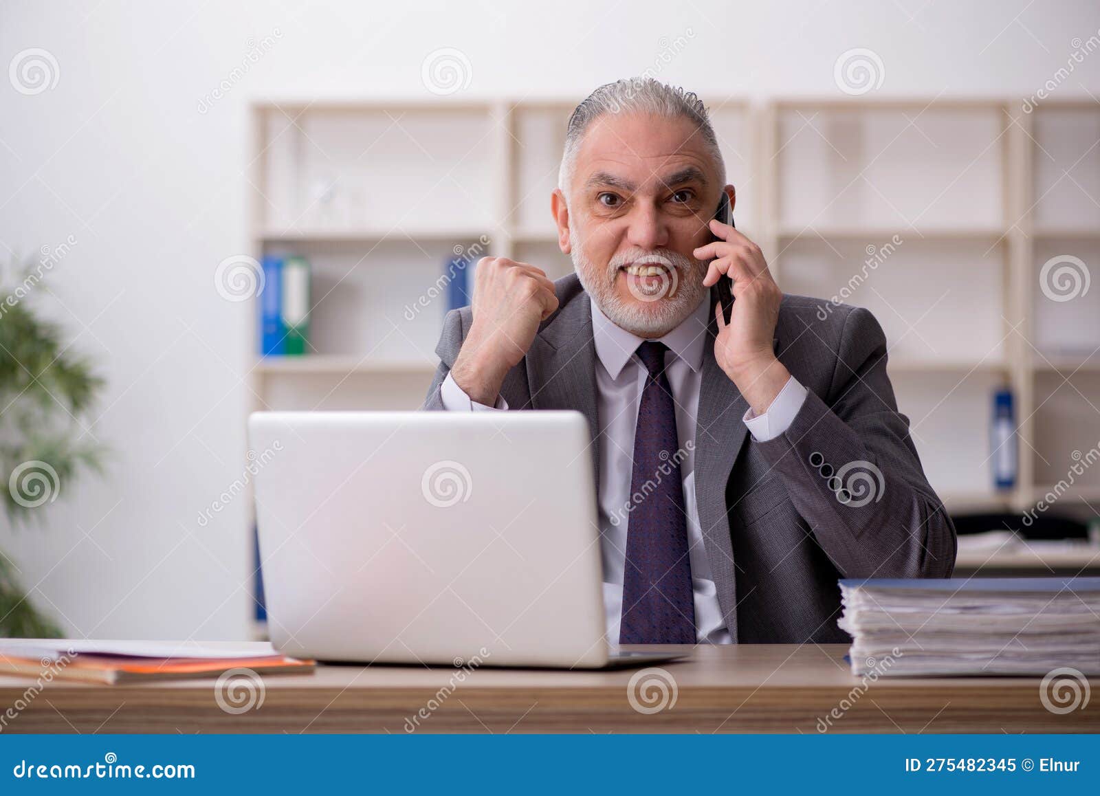 Old Male Employee Speaking by Phone at Workplace Stock Image - Image of ...