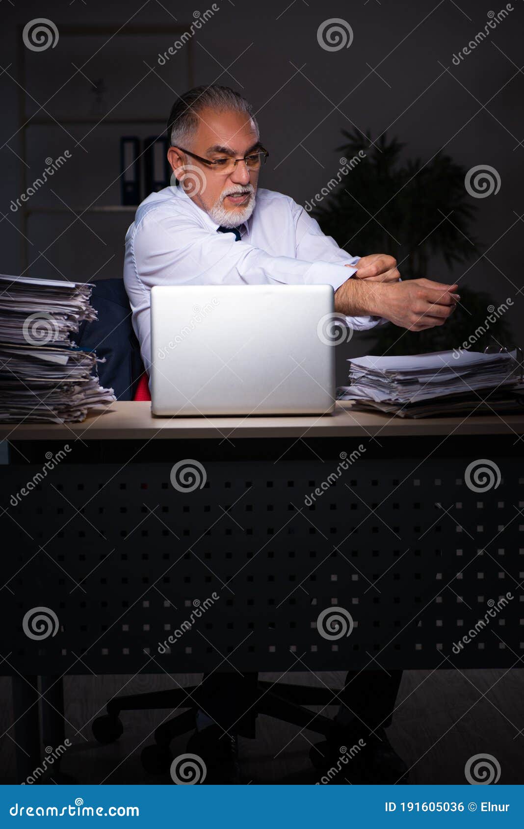 Old Male Employee Working Late at Workplace Stock Photo - Image of ...
