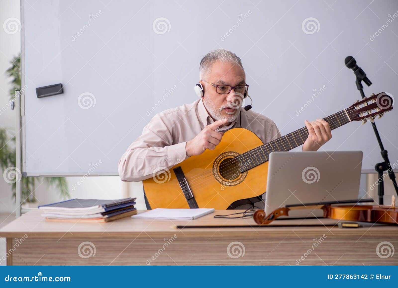 Old Male Music Teacher in the Classroom Stock Photo - Image of showing ...
