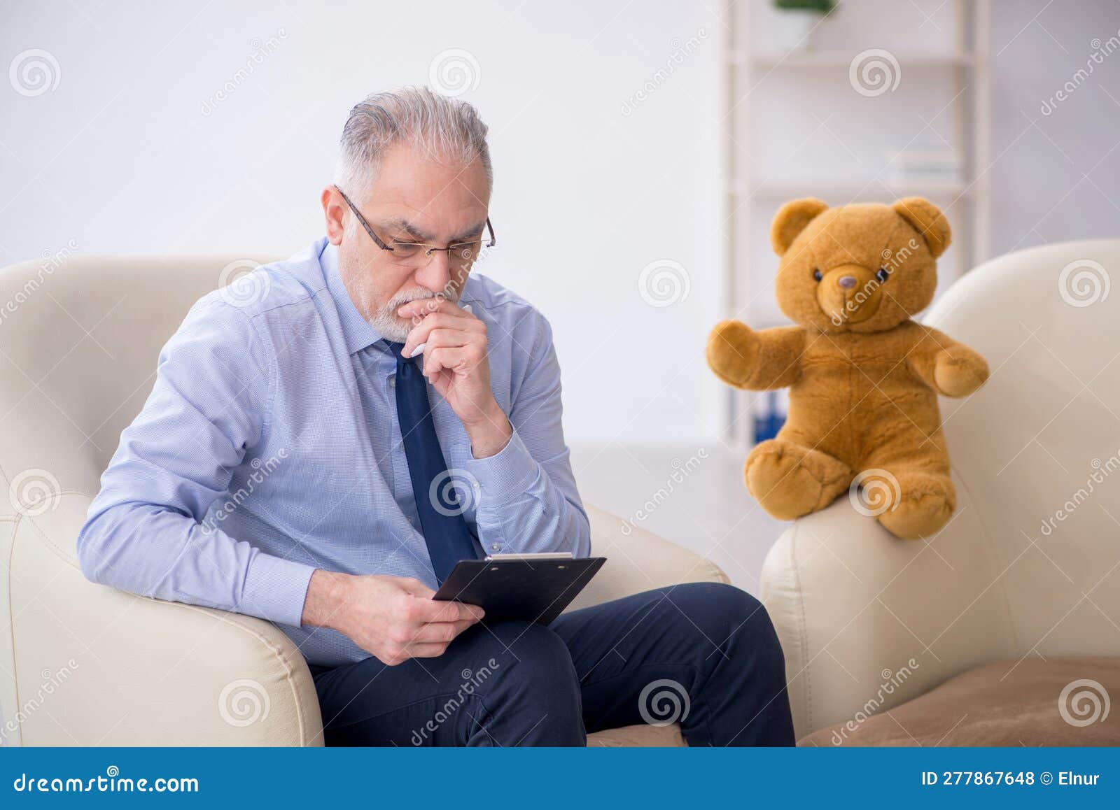 Old Male Psychologist and Soft Bear in the Room Stock Photo - Image of ...