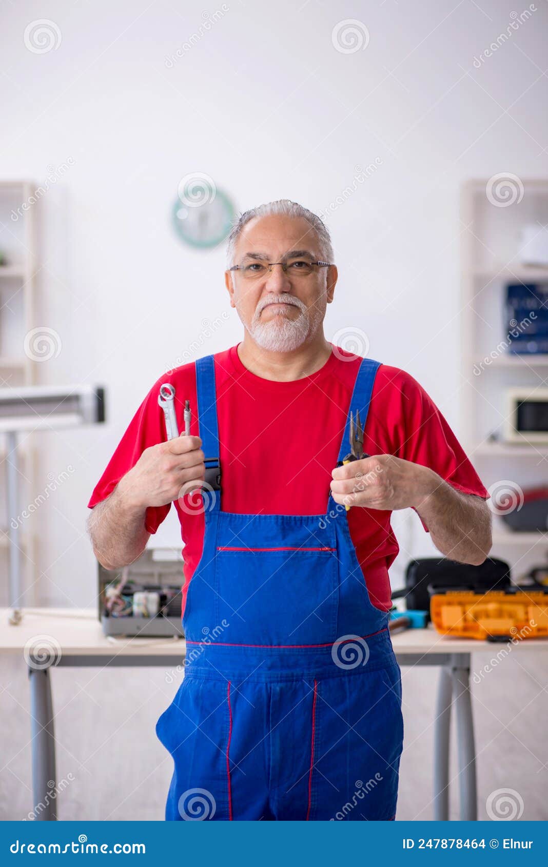 Old Male Repairman at Workshop Stock Photo - Image of wrench, worker ...