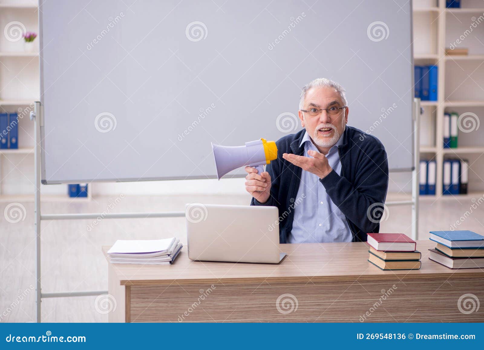 Old Male Teacher Holding Megaphone in the Classroom Stock Photo - Image ...