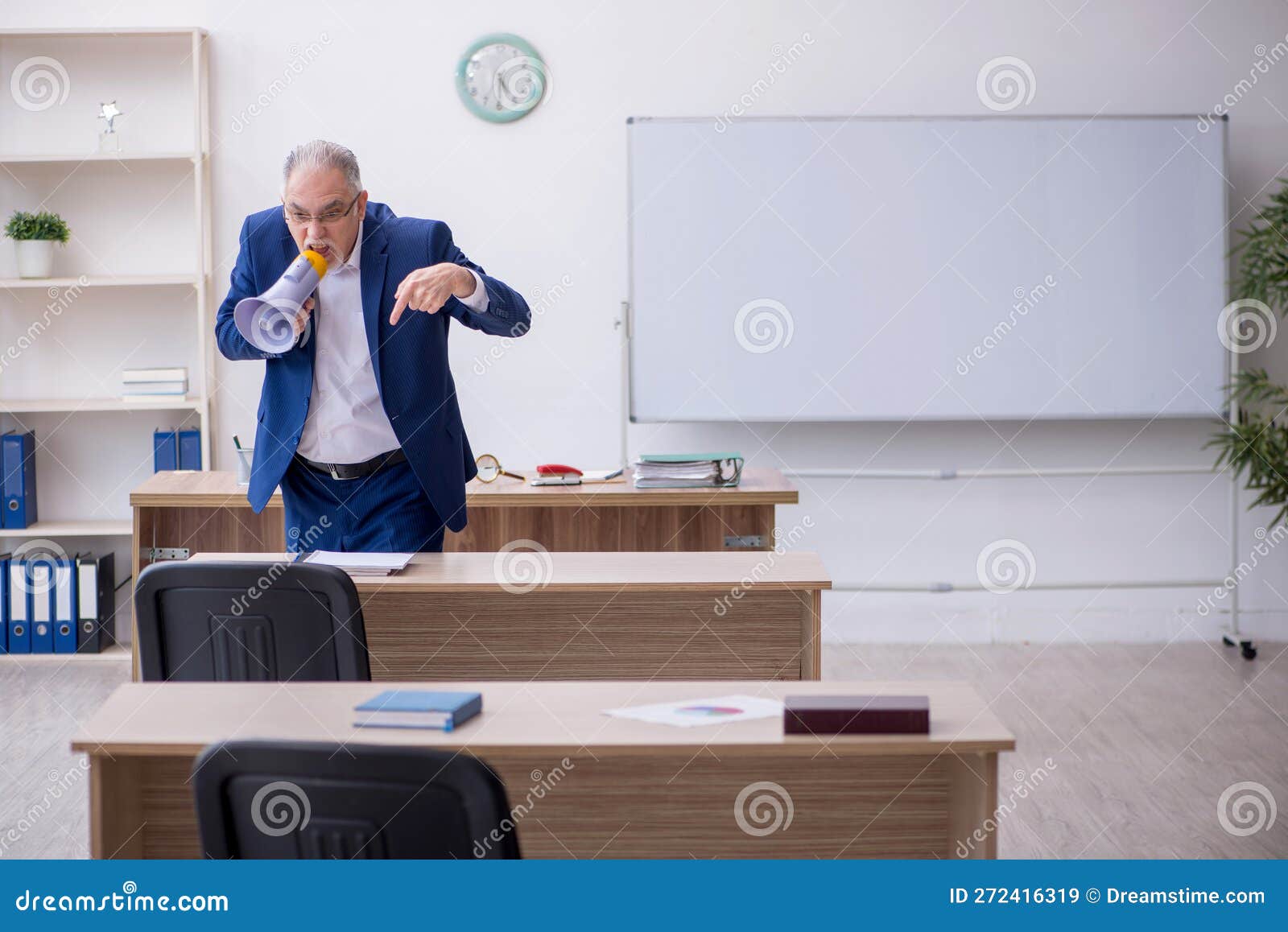 Old Male Teacher Holding Megaphone in the Classroom Stock Image - Image ...
