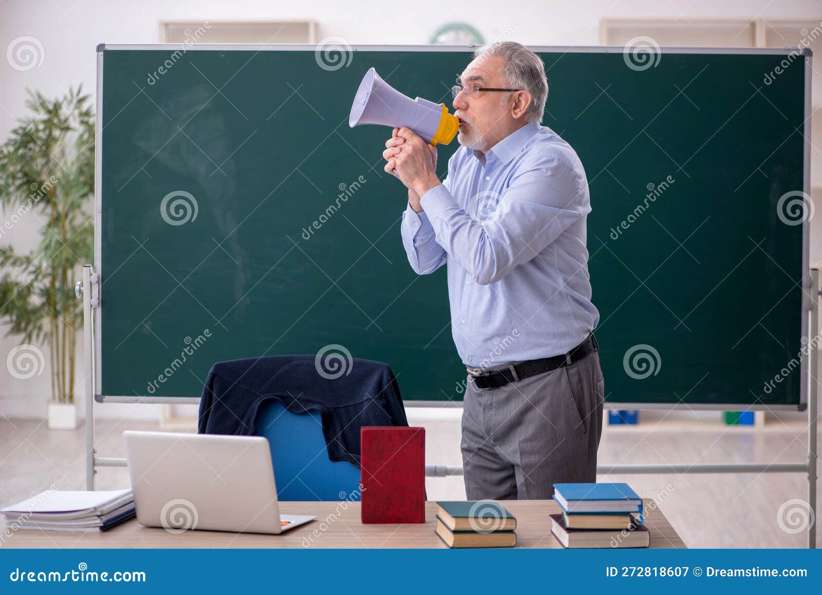 Old Male Teacher Holding Megaphone in the Classroom Stock Image - Image ...