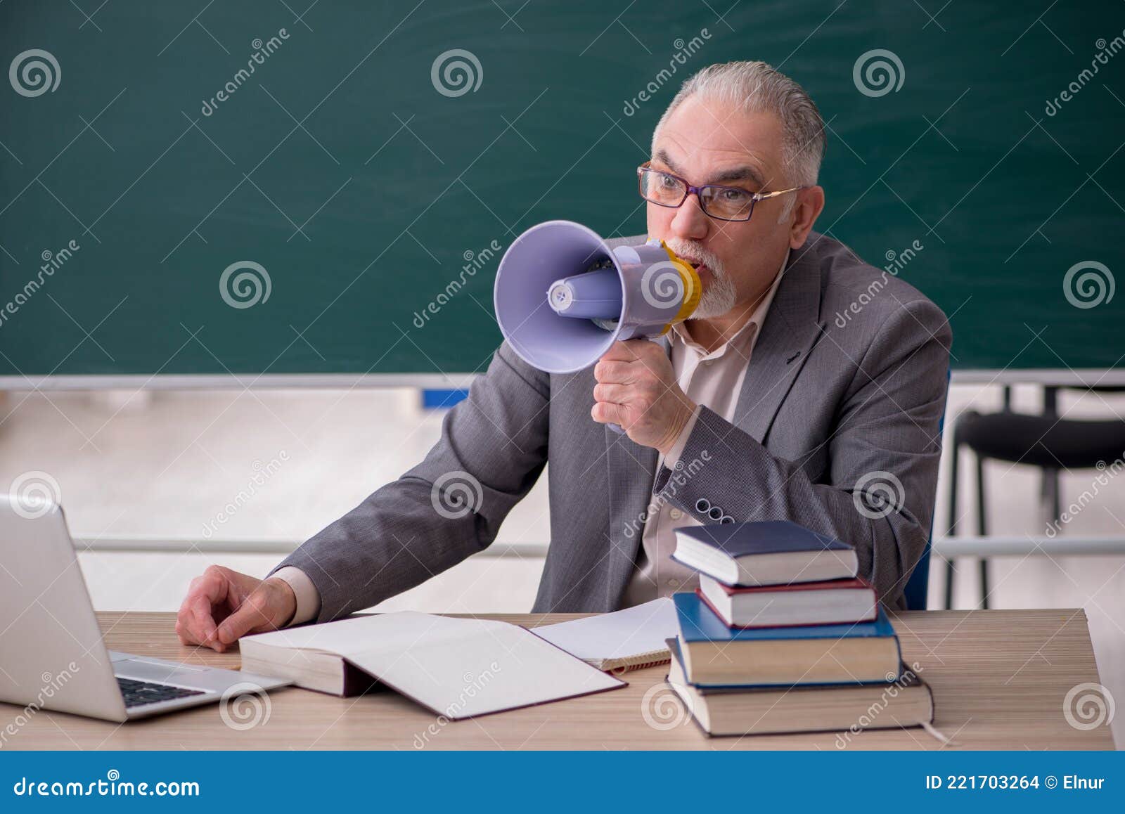 Old Male Teacher Holding Megaphone in Front of Blackboard Stock Photo ...