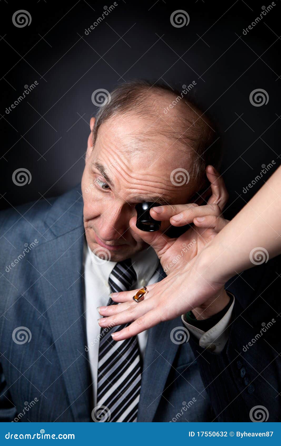 Old Man Appraising Quality of Ring with Stone Stock Photo - Image of ...