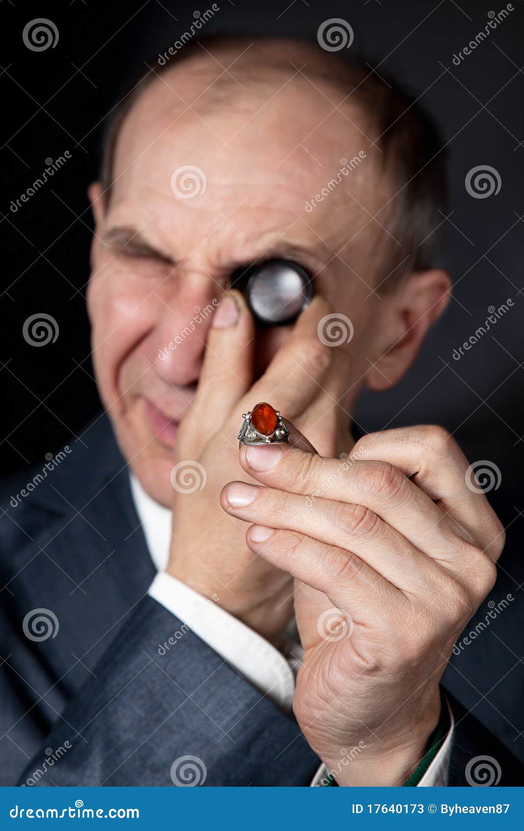 Old Man Appraising Quality Of Ring With Stone Stock Photos - Image ...