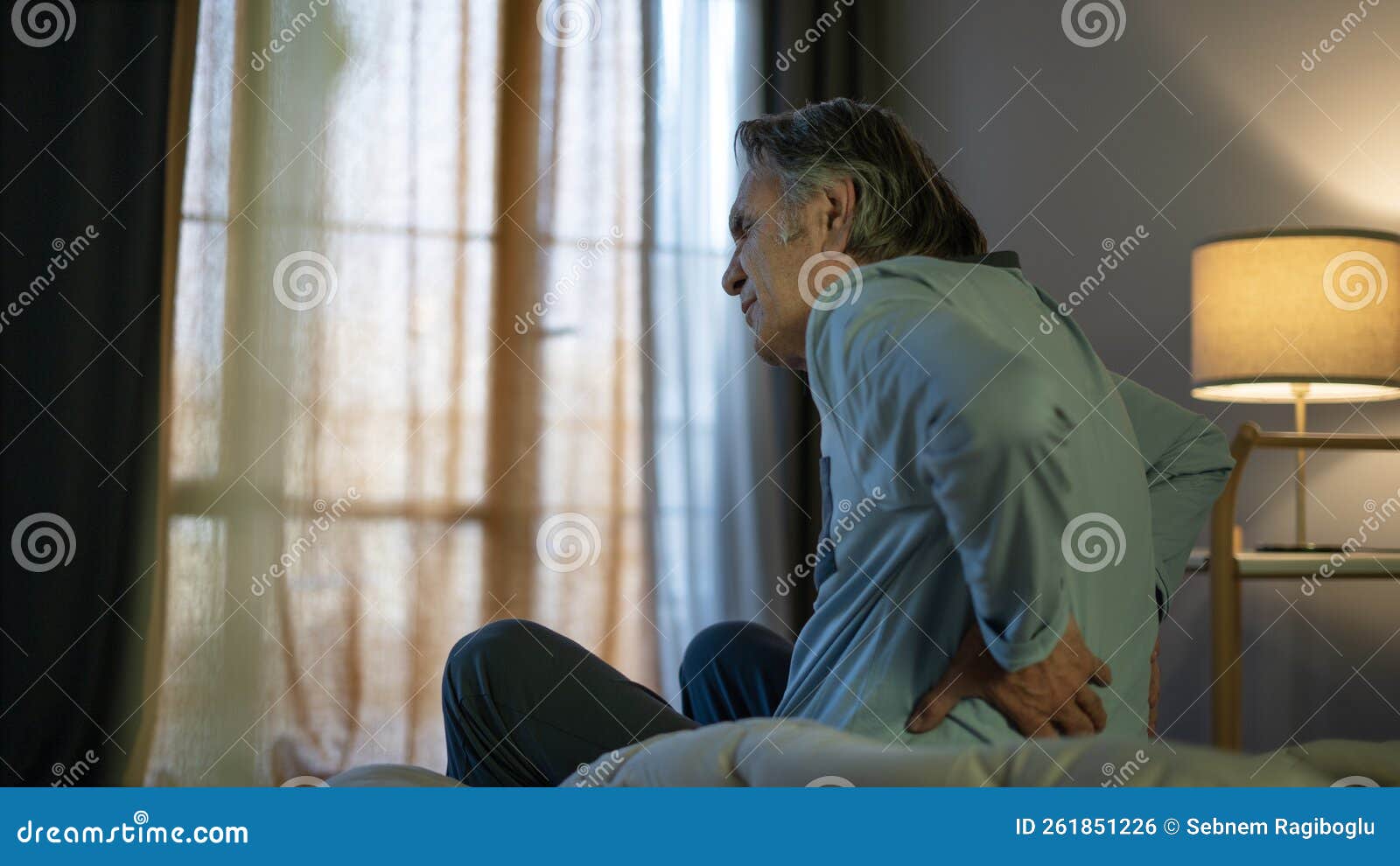 Old Man with Backache Sitting on Bed Stock Photo - Image of elder ...