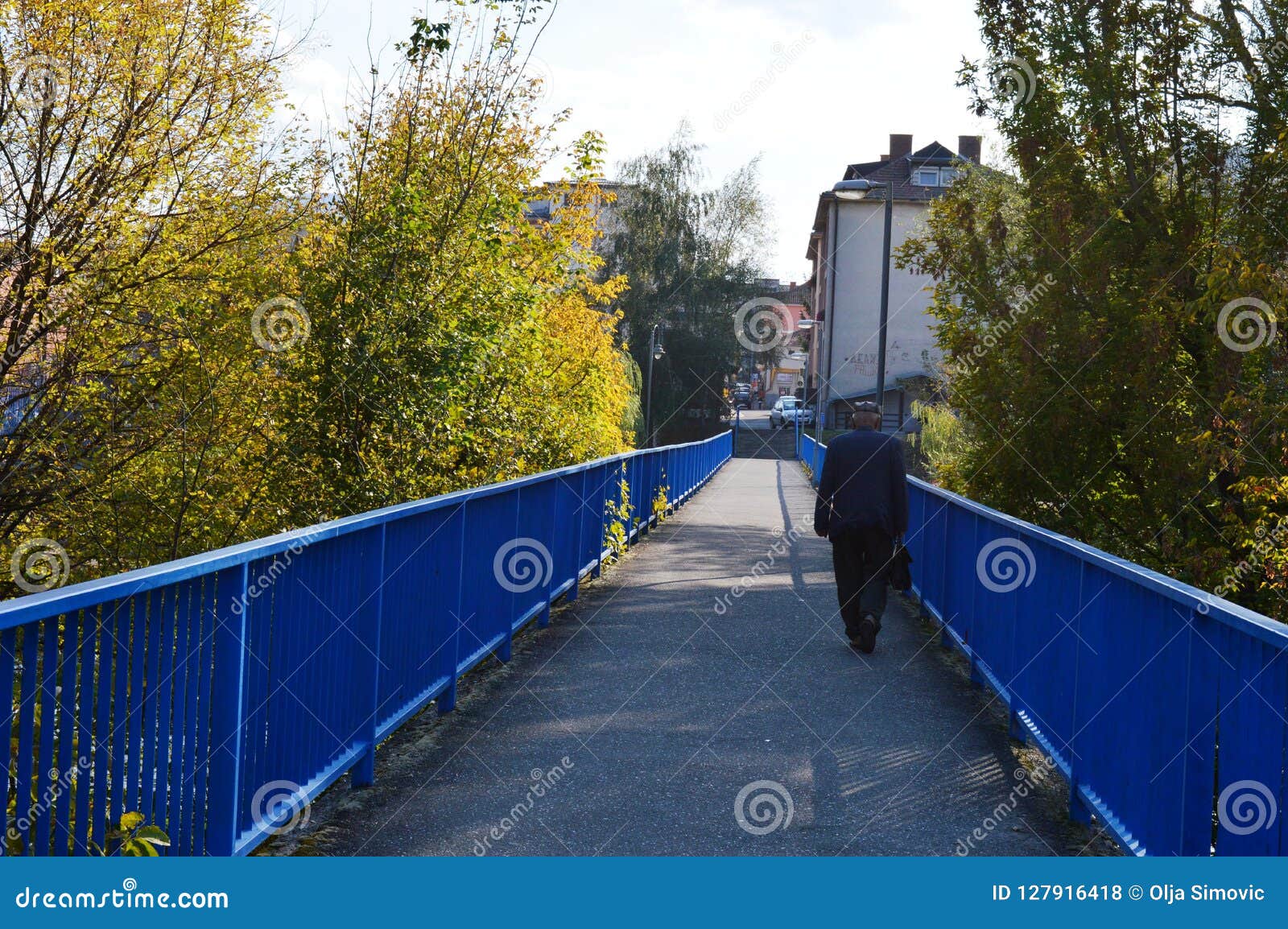 Man on the bridge stock photo. Image of hill, fence - 127916418